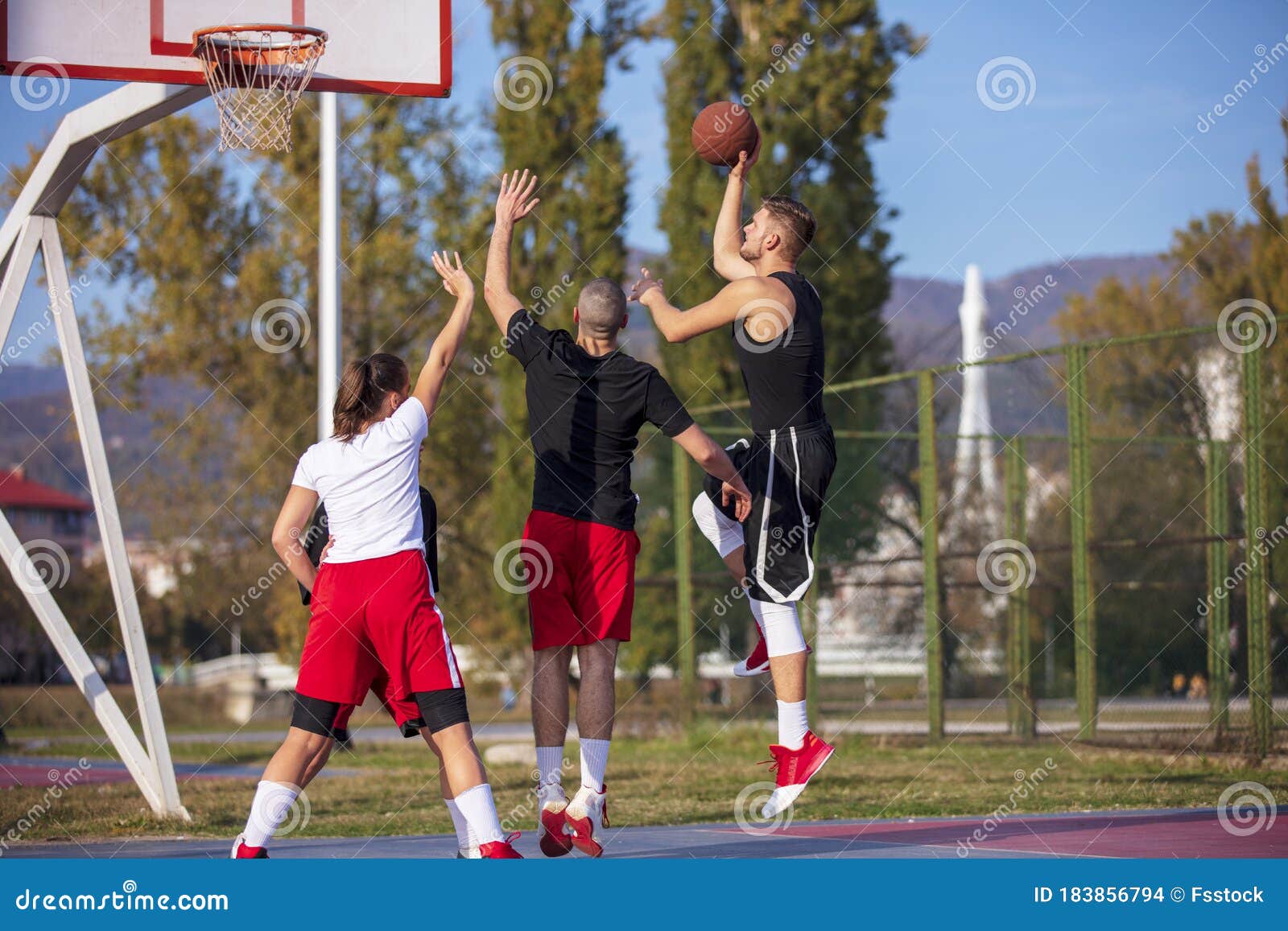 Group of Young Friends Playing Basketball Match Stock Photo - Image of ...