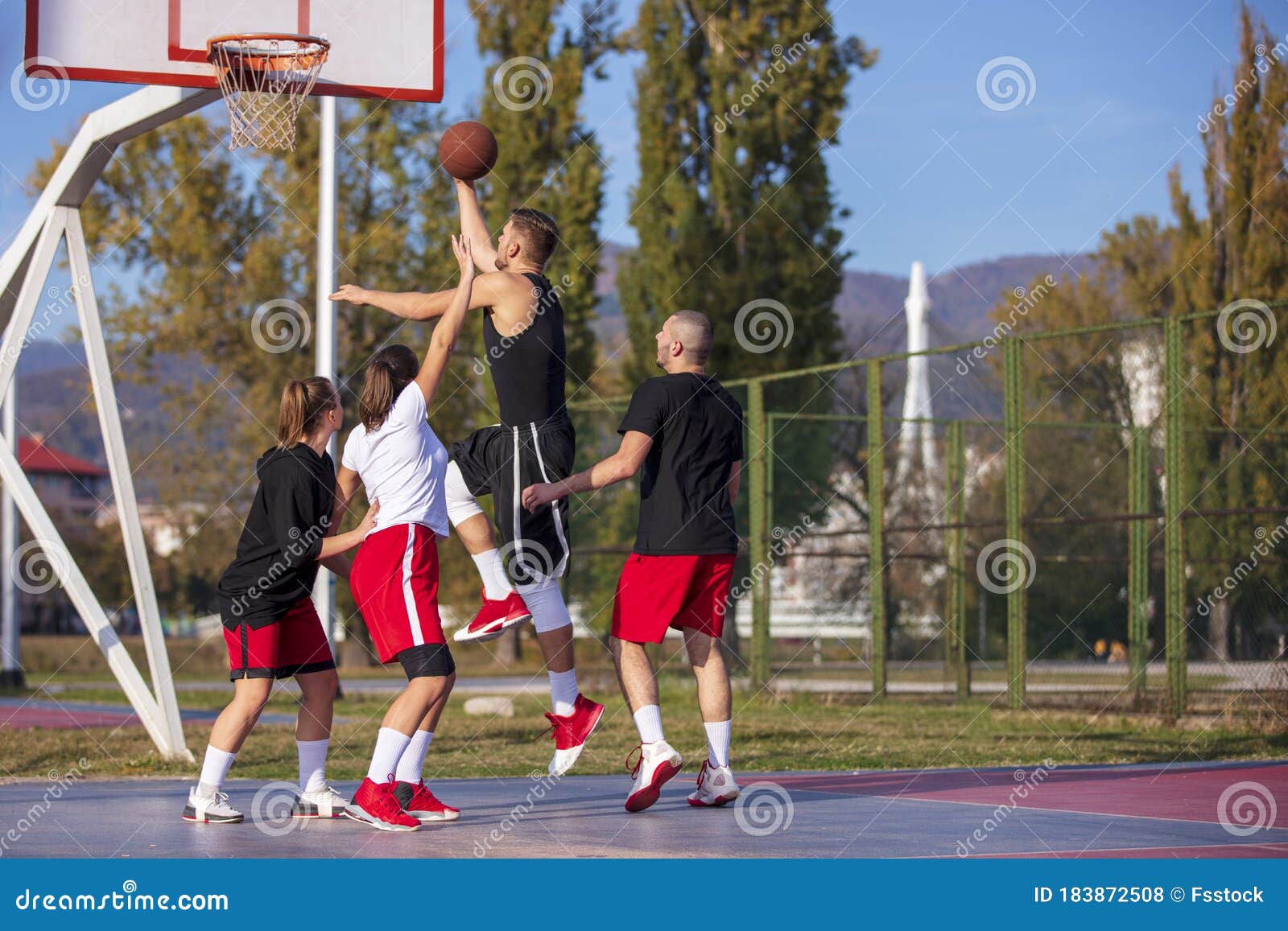 Group of Young Friends Playing Basketball Match Stock Photo - Image of ...