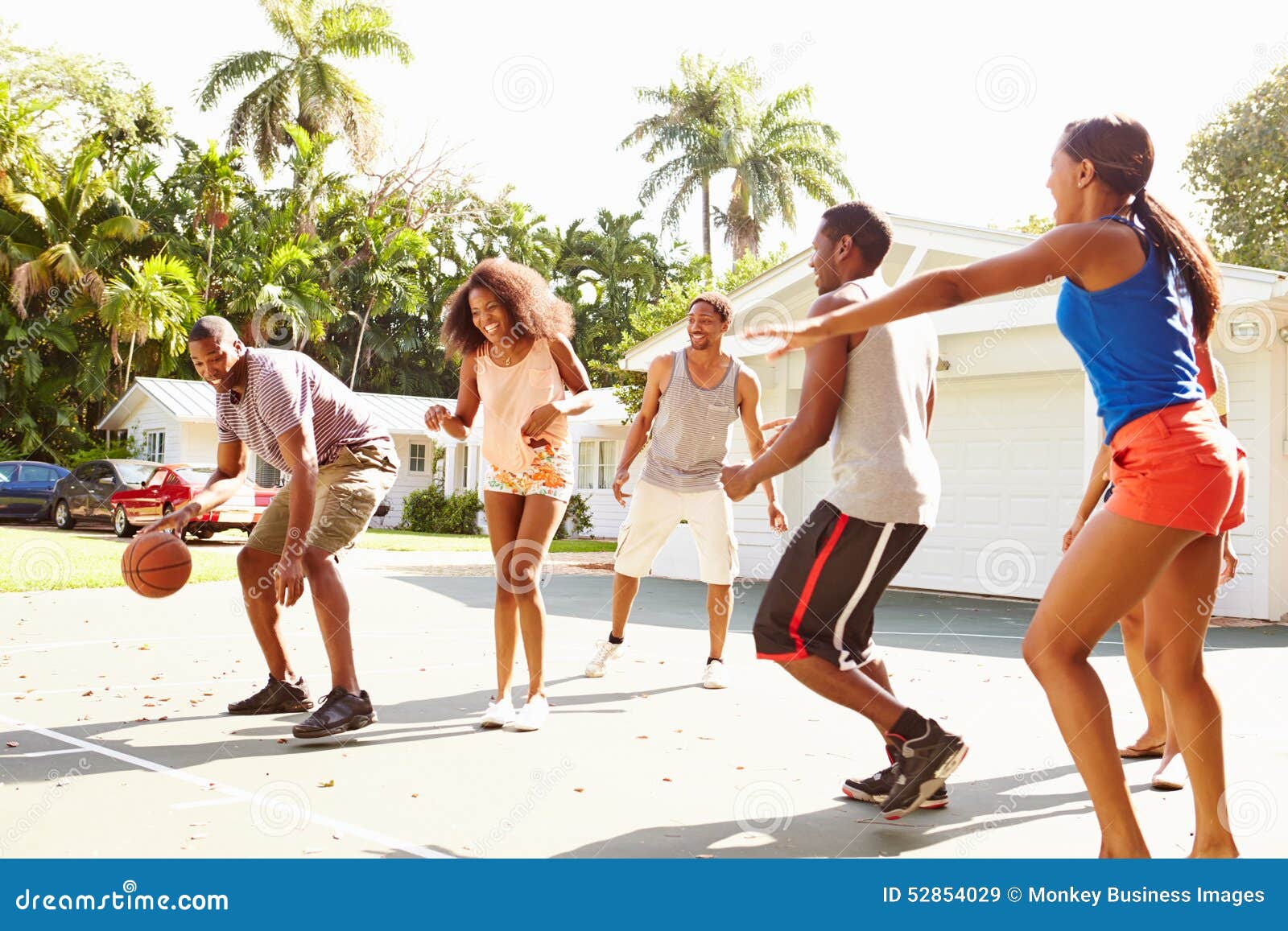 Group of Young Friends Playing Basketball Match Stock Image - Image of ...