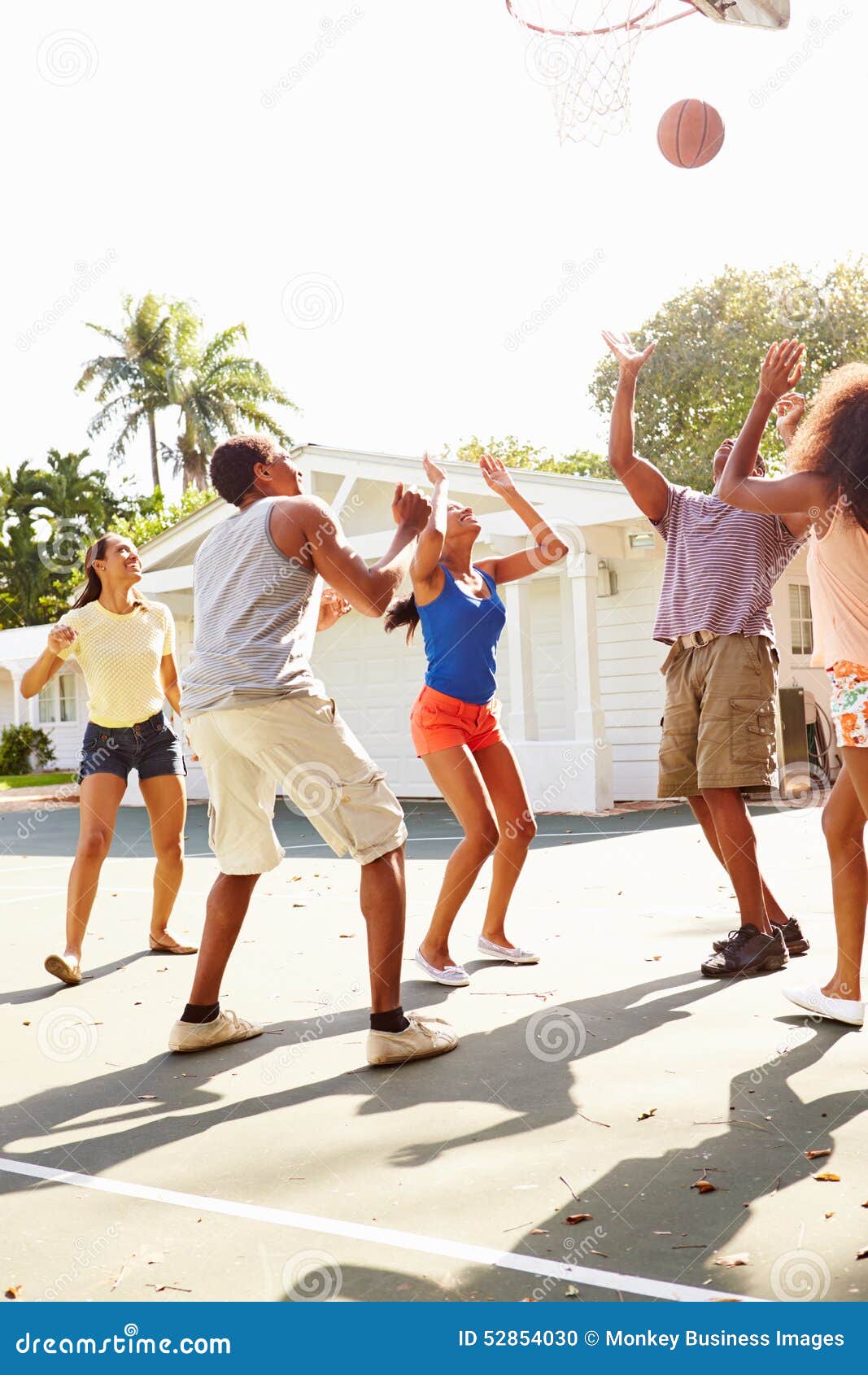 Group of Young Friends Playing Basketball Match Stock Photo - Image of ...