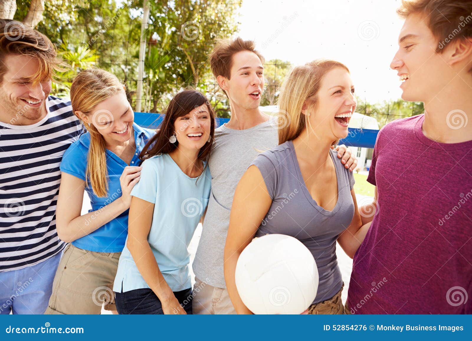 Group of Young Friends Playing Volleyball Match Stock Photo - Image of ...