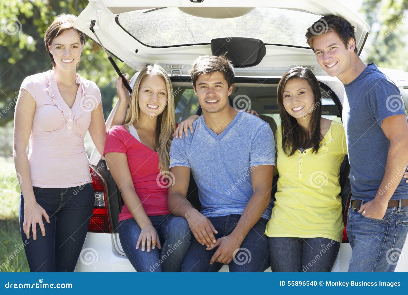 Group of Young Friends Sitting in Trunk of Car Stock Photo - Image of ...