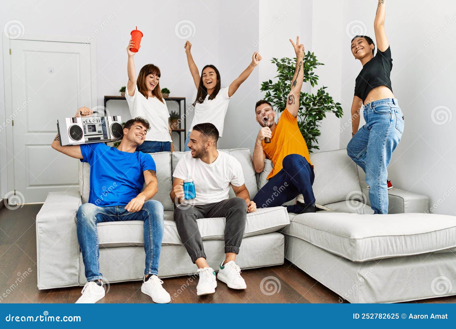Group of Young Friends Smiling Happy and Dancing at Home Stock Image ...