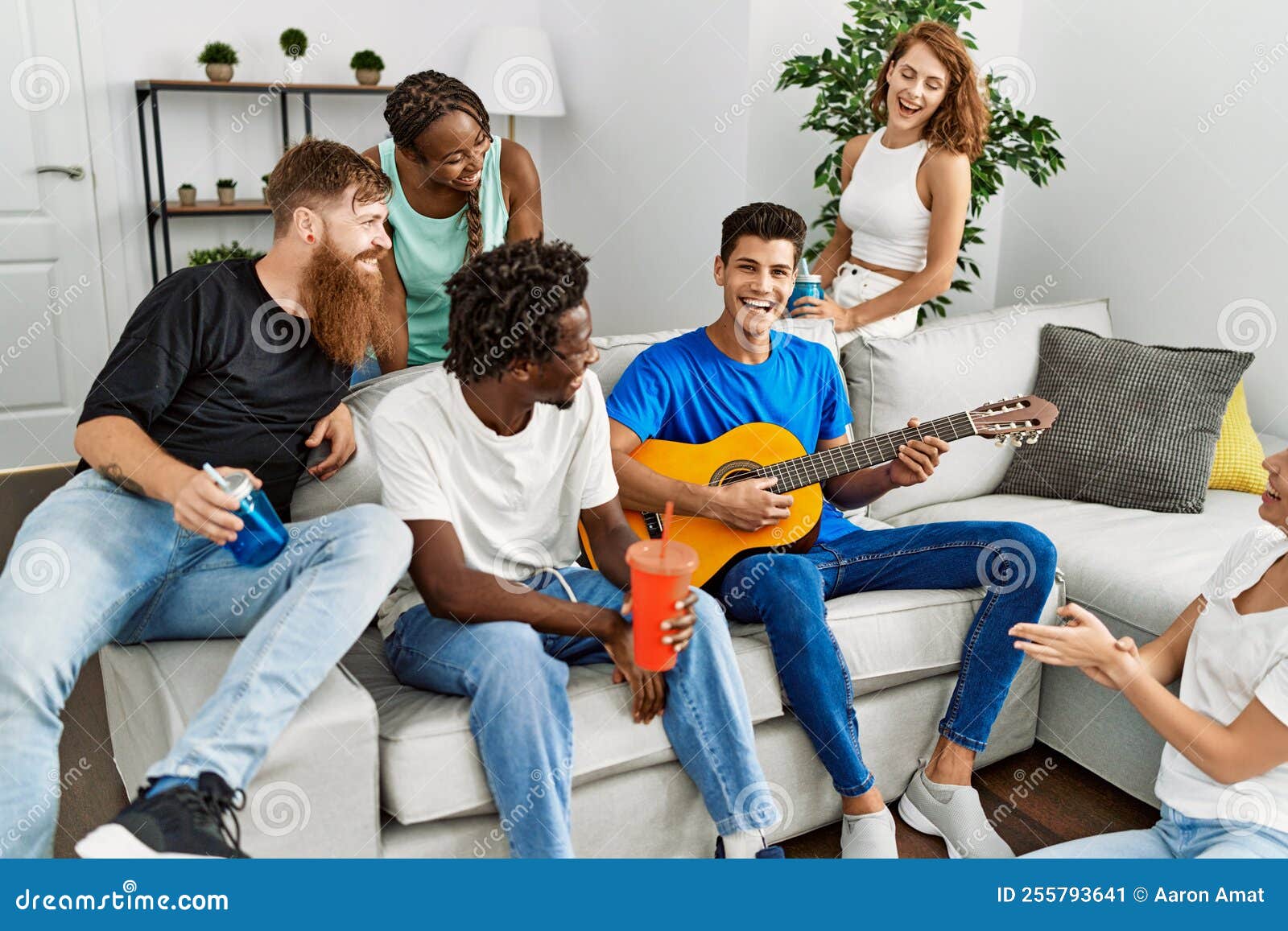 Group of Young Friends Smiling Happy and Playing Classical Guitar at ...