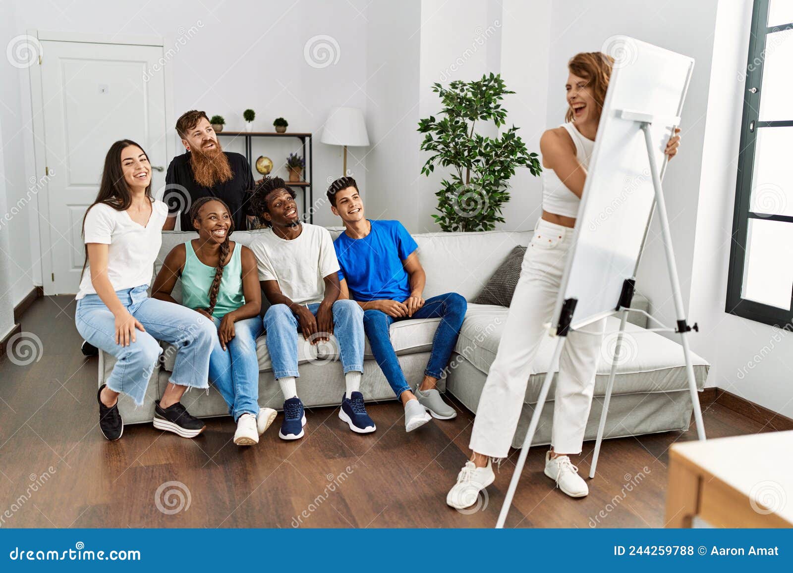 Group of Young Friends Smiling Happy Playing Drawing Game at Home Stock ...