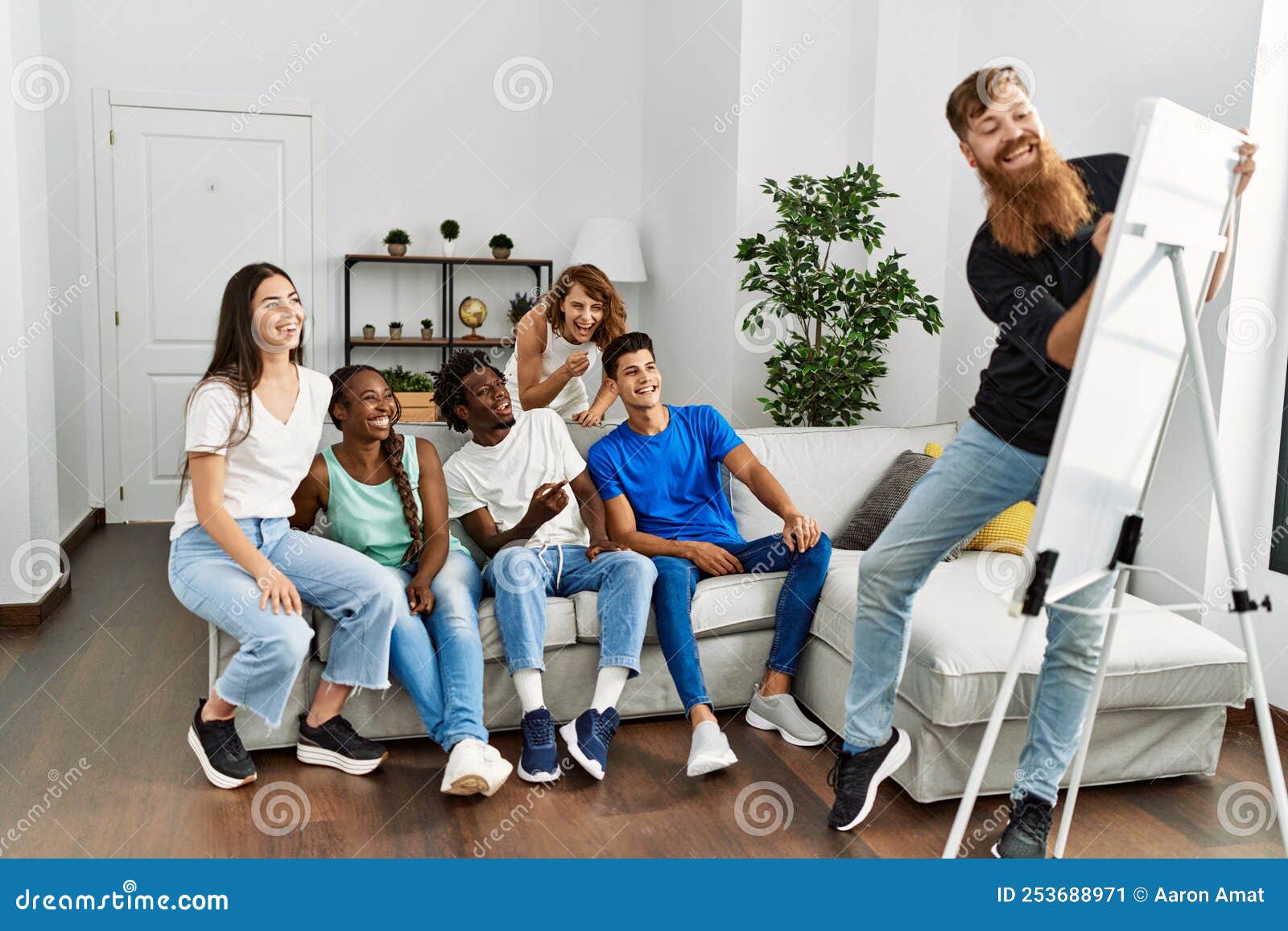 Group of Young Friends Smiling Happy Playing Drawing Game at Home Stock ...
