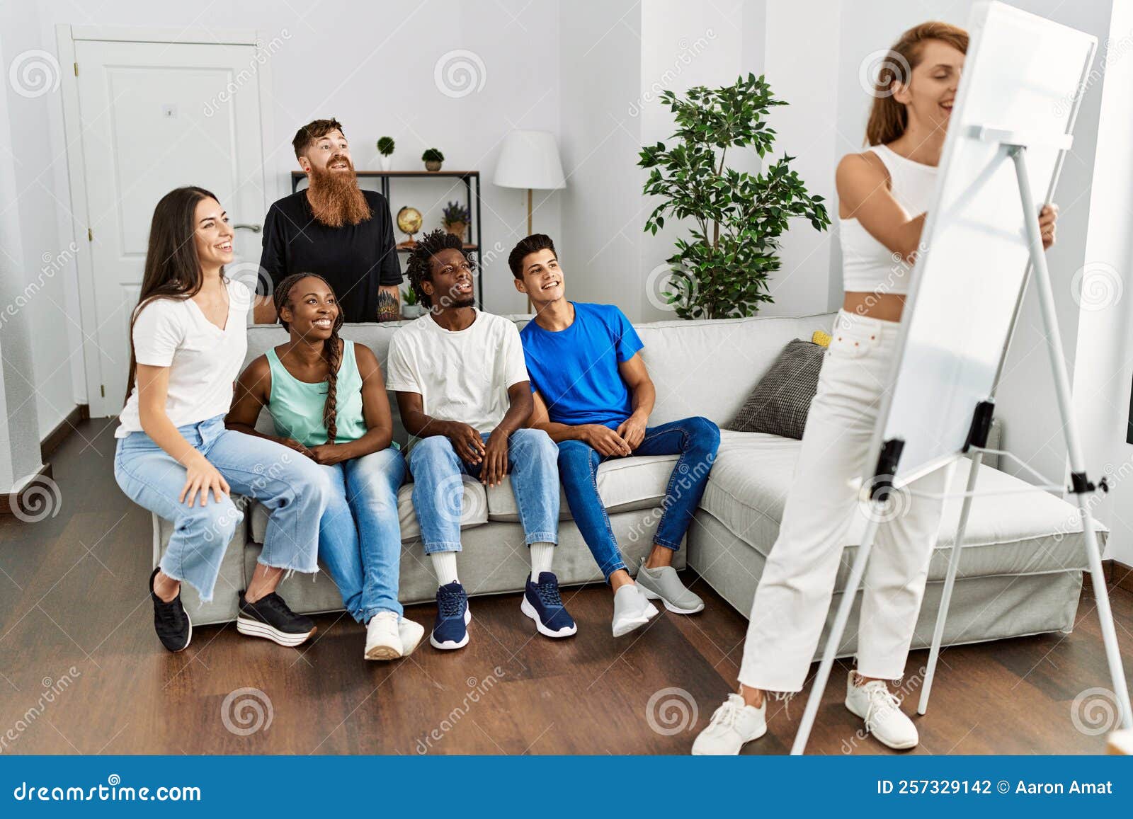 Group of Young Friends Smiling Happy Playing Drawing Game at Home Stock ...