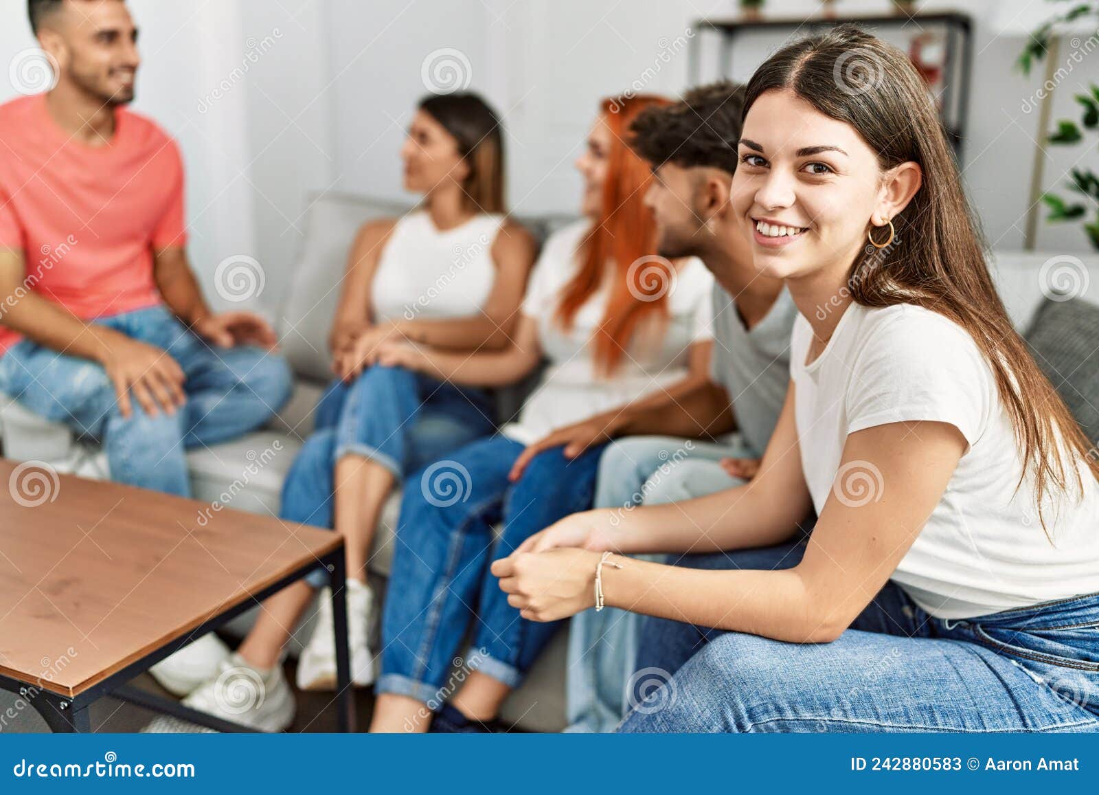 Group of Young Friends Smiling Happy Sitting on the Sofa at Home Stock ...