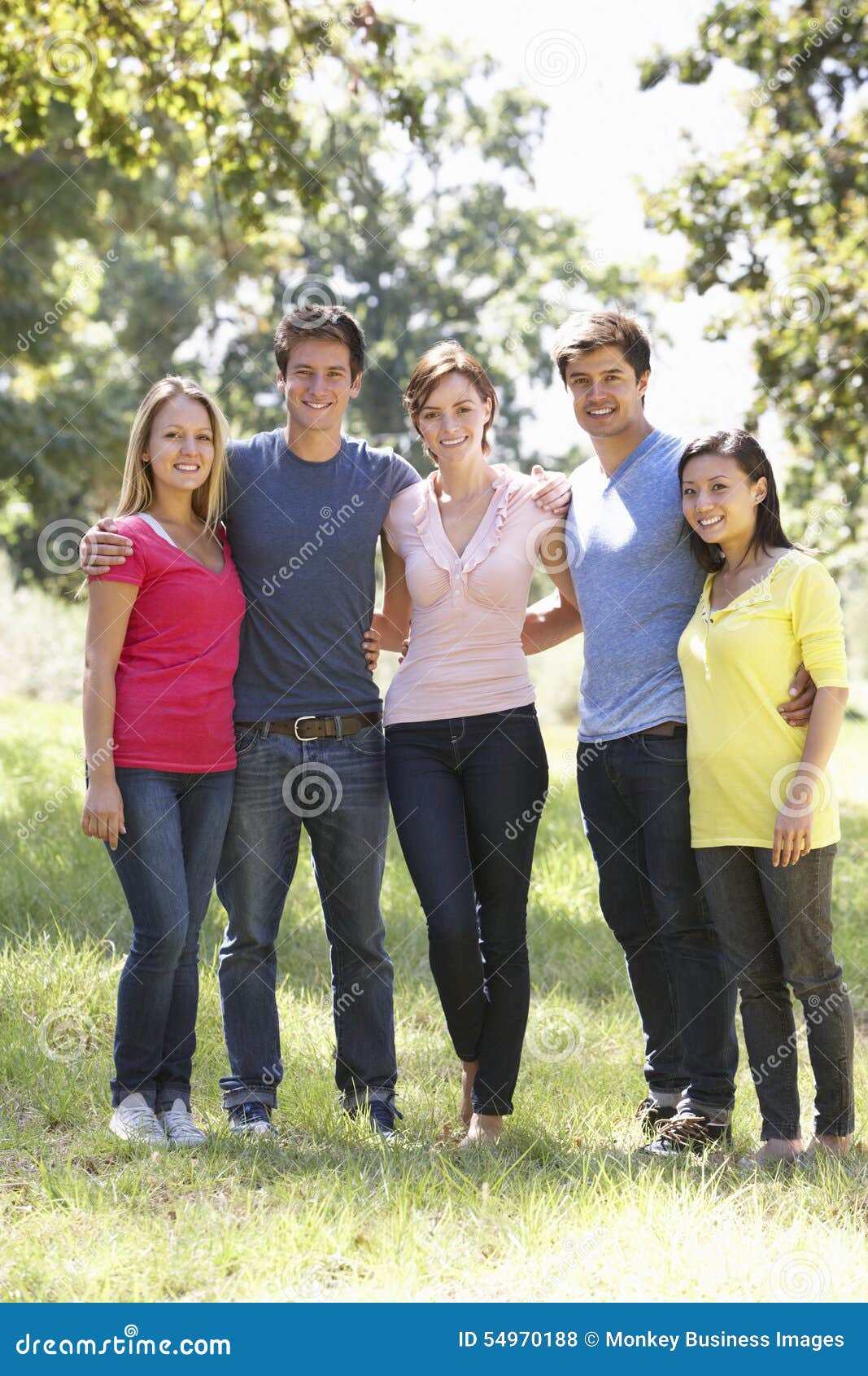 Group of Young Friends Walking through Countryside Stock Photo - Image ...