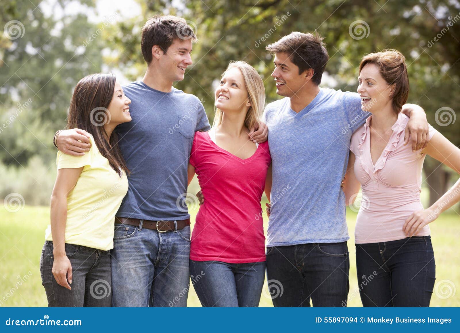 Group of Young Friends Walking through Countryside Stock Photo - Image ...