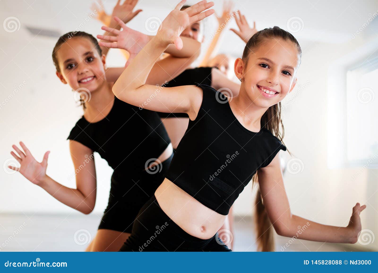Group of Young Girls Practicing and Exercising Modern Ballet Dance ...