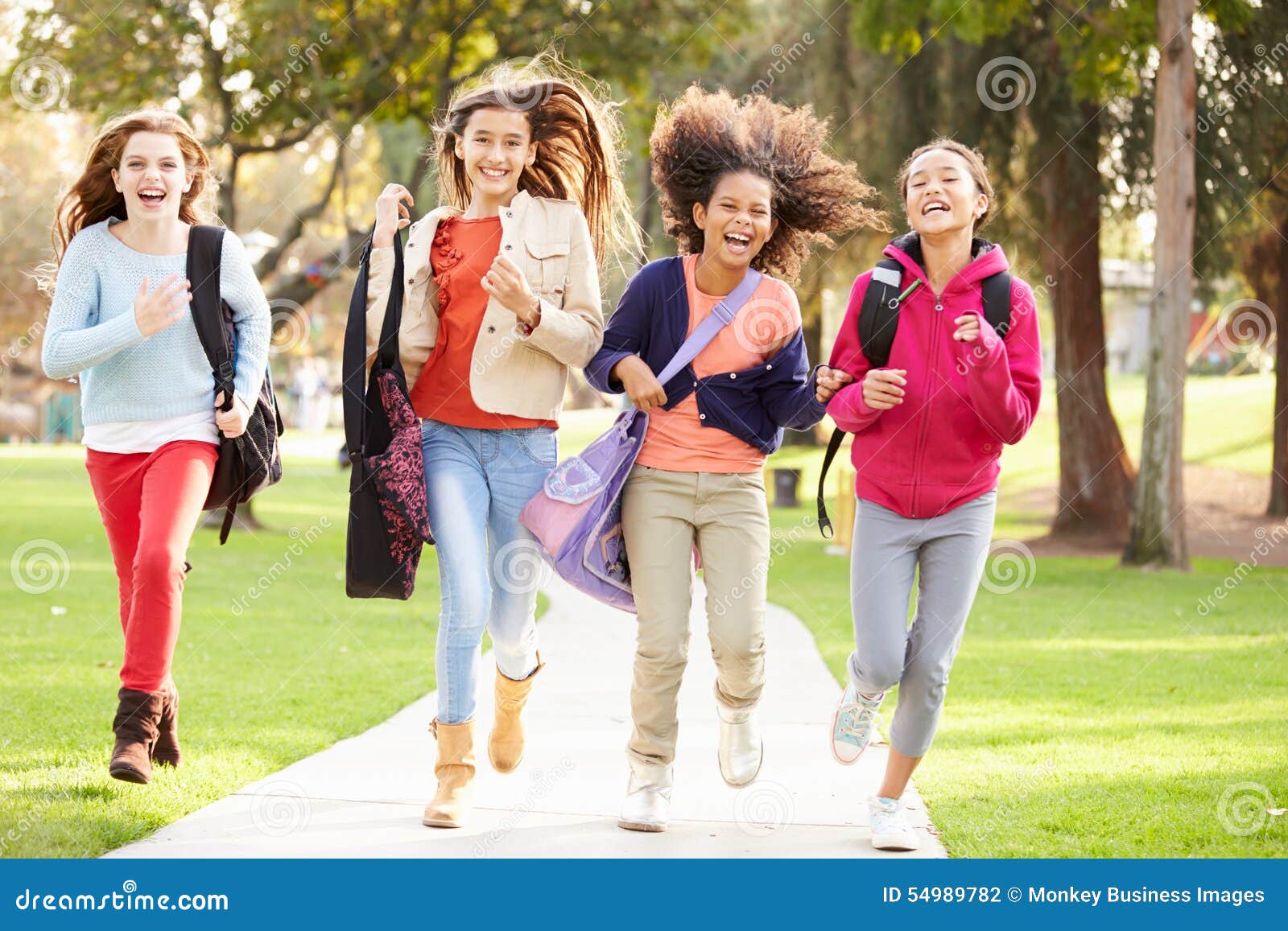 Group of Young Girls Running Towards Camera in Park Stock Photo - Image ...
