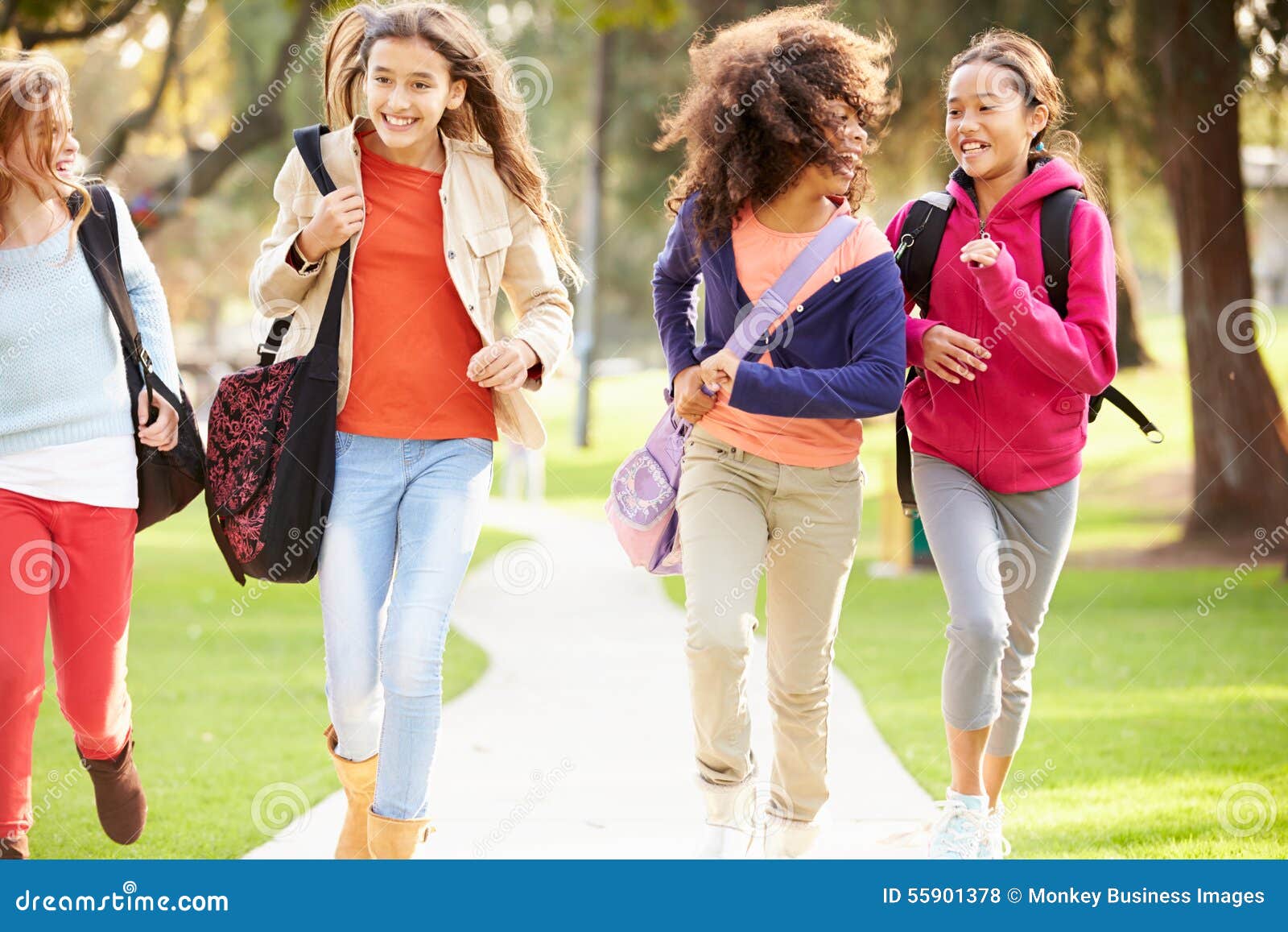 Group of Young Girls Running Towards Camera in Park Stock Photo - Image ...