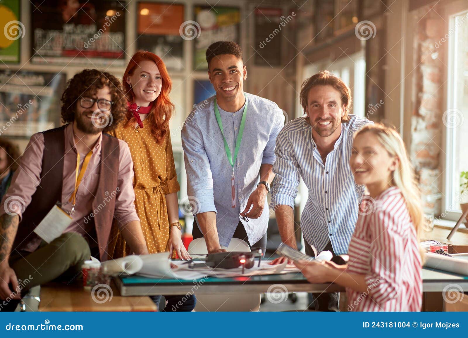 Group of Young Happy Engineers Projecting Together Stock Photo - Image ...