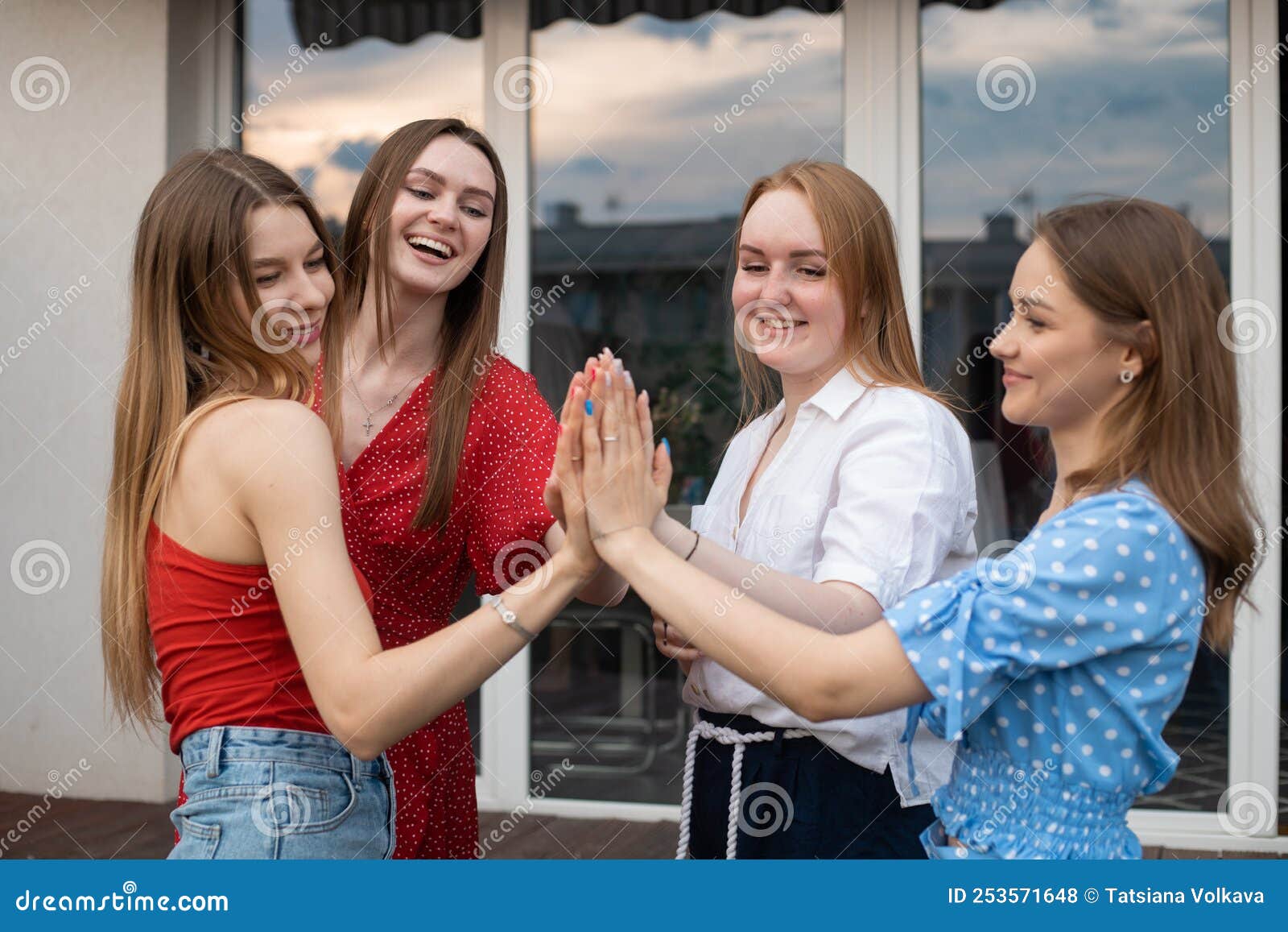 Group of Young Happy Gorgeous Women Folding Hands in Stack, Giving High ...