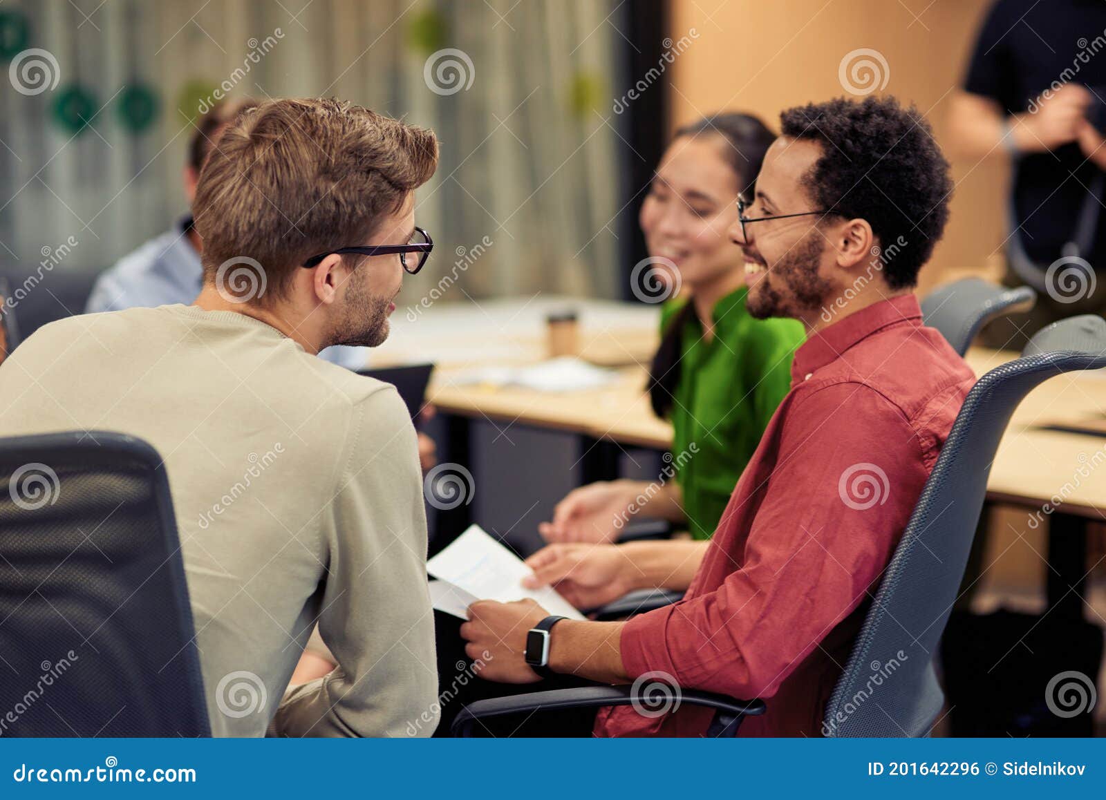 Group of Young Happy Multi Racial Coworkers Communicating and Sharing ...