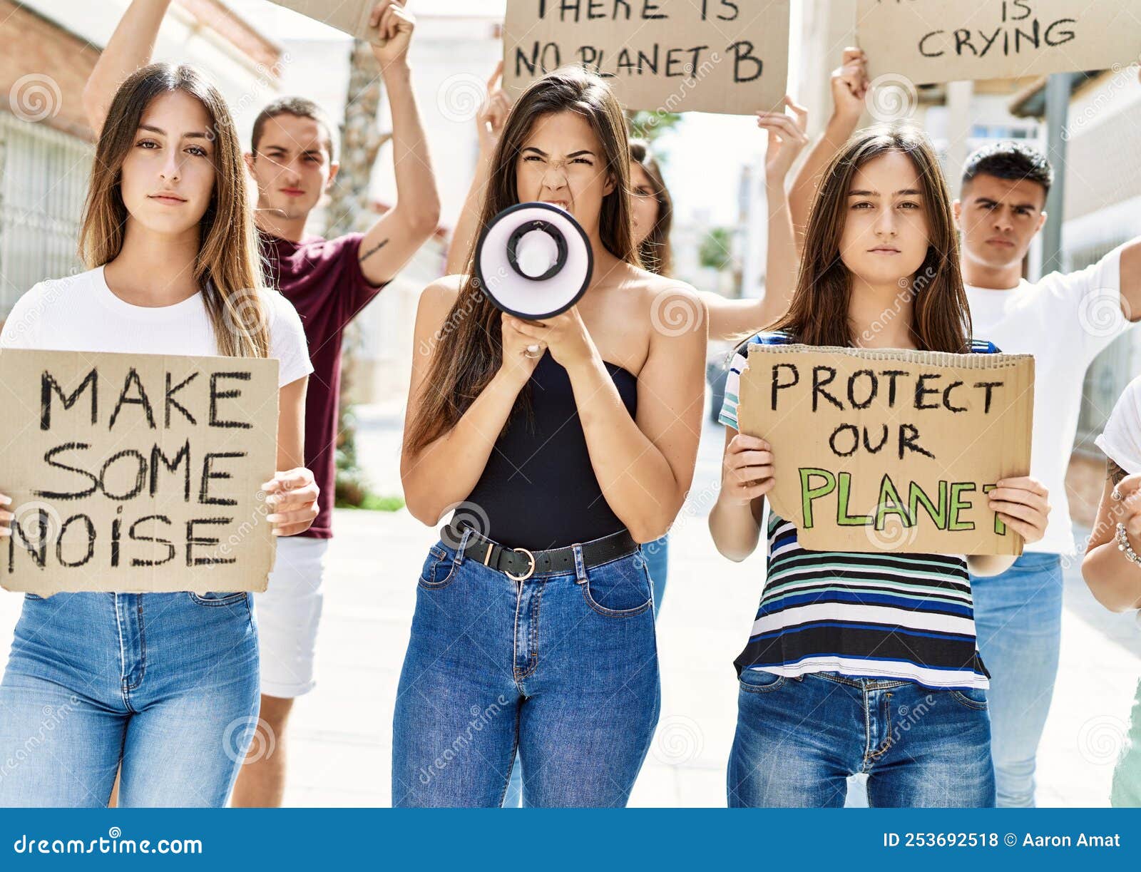 Group of Young Hispanic Activists Protesting Holding Banner and Using ...