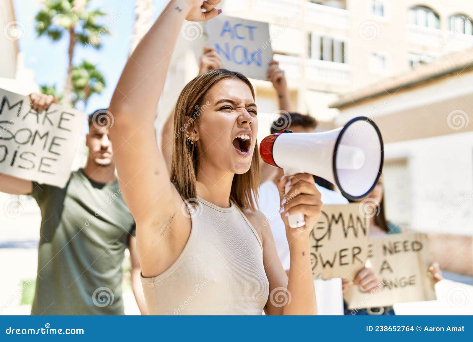 Group of Young Hispanic Activists Protesting Holding Banner and Using ...