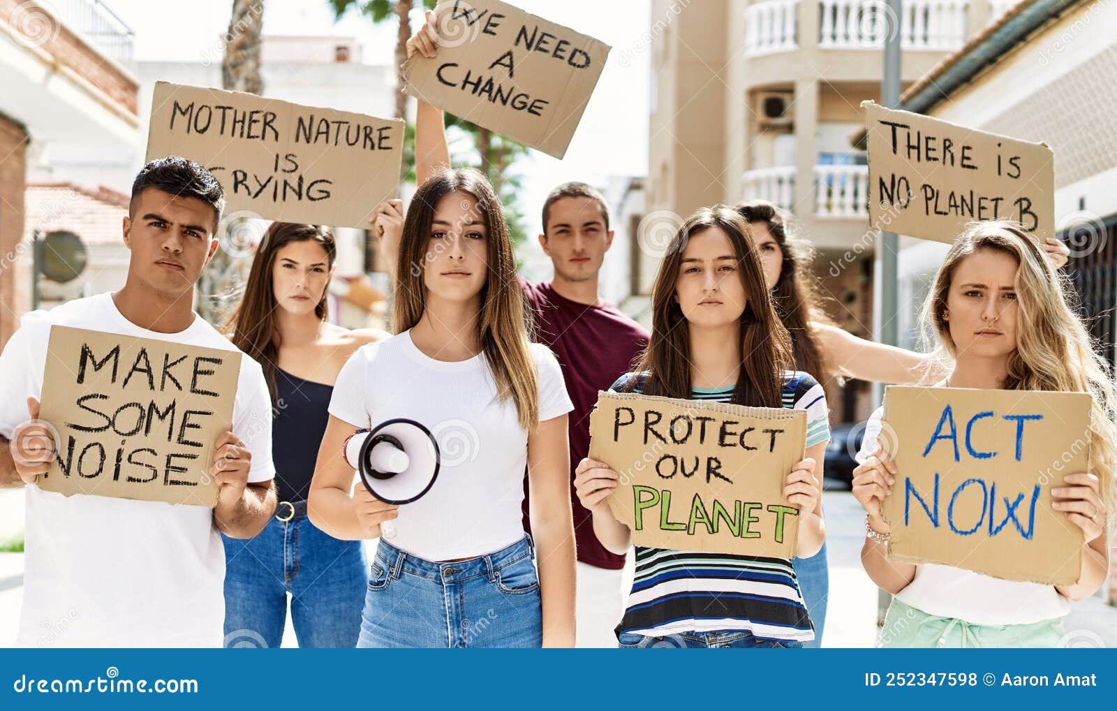 Group of Young Hispanic Activists Protesting Holding Banner and Using ...