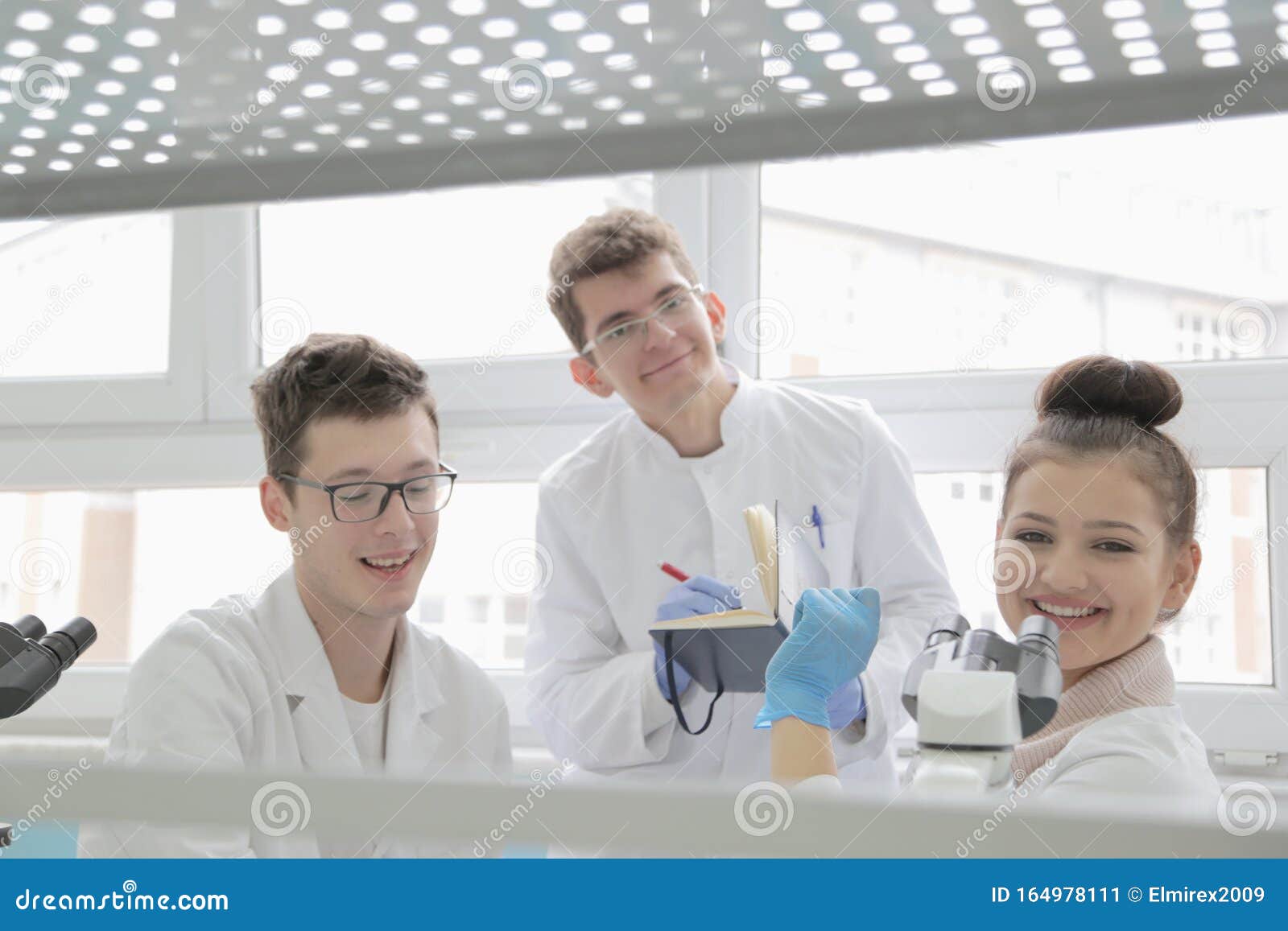 Group of Young Laboratory Scientists Working at Lab with Test Tu Stock ...