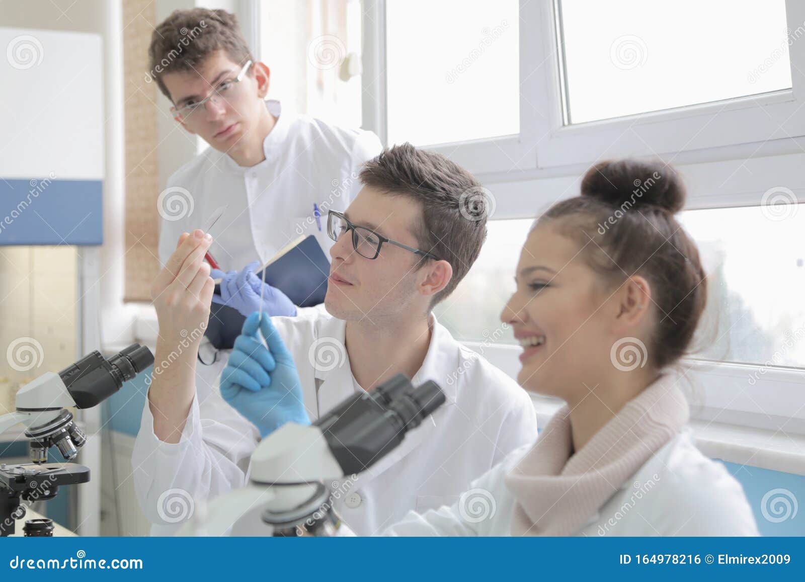 Group of Young Laboratory Scientists Working at Lab with Test Tu Stock ...