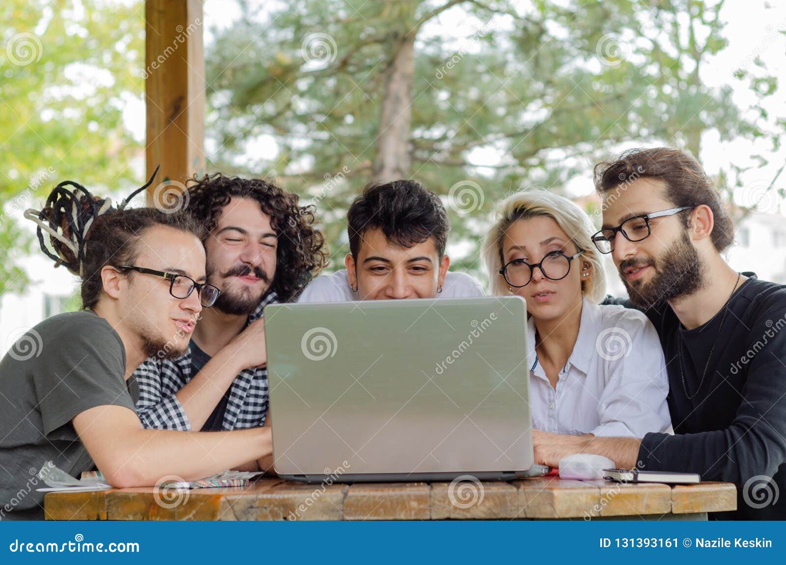 A Group of Young Working with Laptop in the Park. Stock Image - Image ...