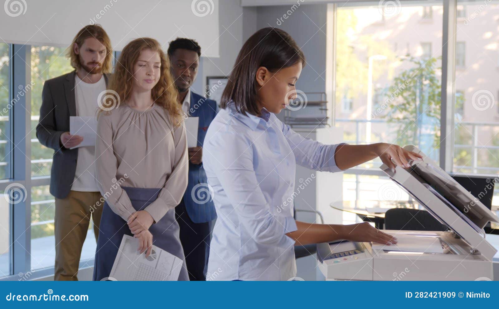 Group of Young Managers Standing in Queue for Copier at Office Stock ...