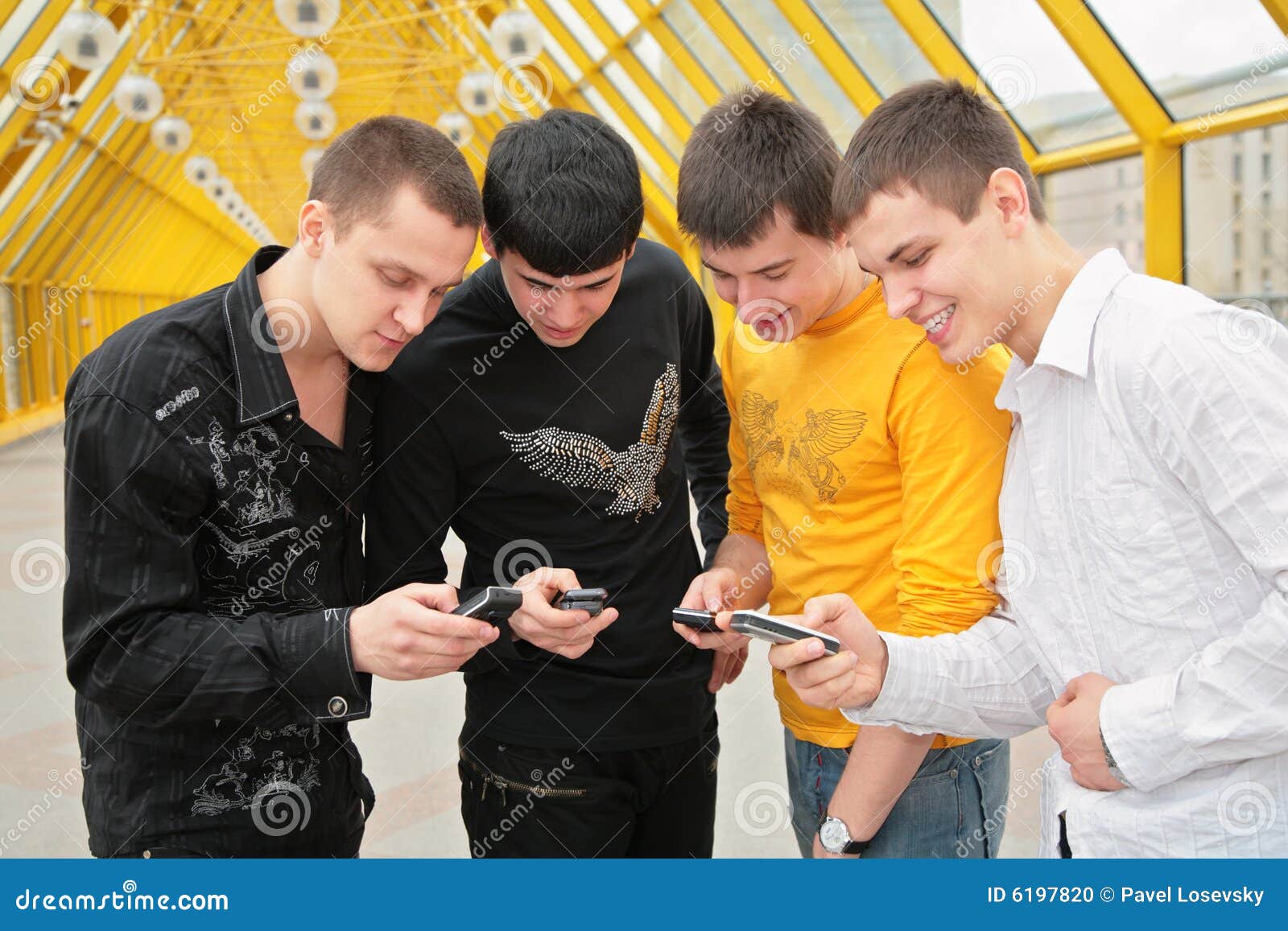 Group of Young Men with Cell Phones Stock Photo - Image of brunet ...