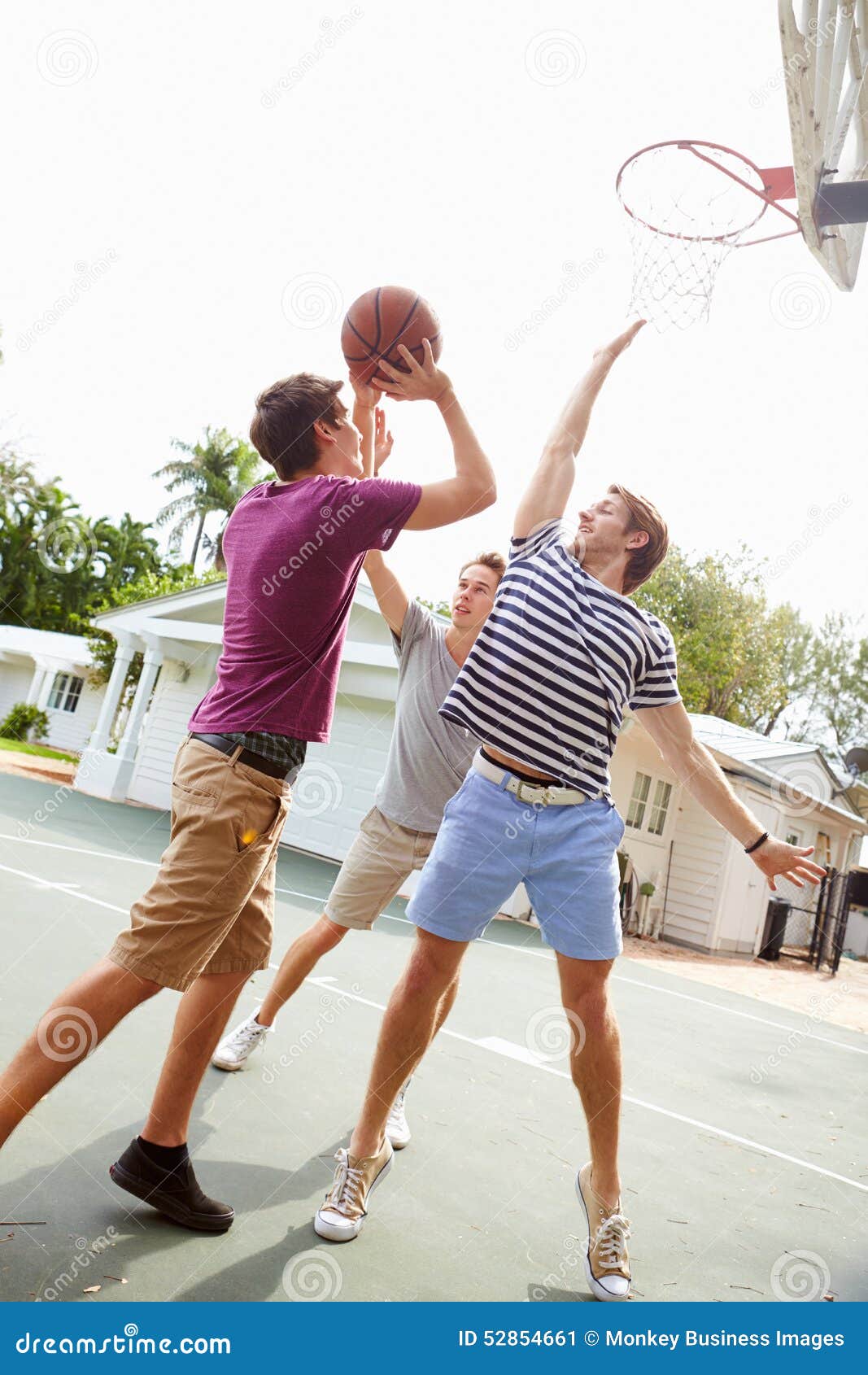 Group of Young Men Playing Basketball Match Stock Image - Image of ...