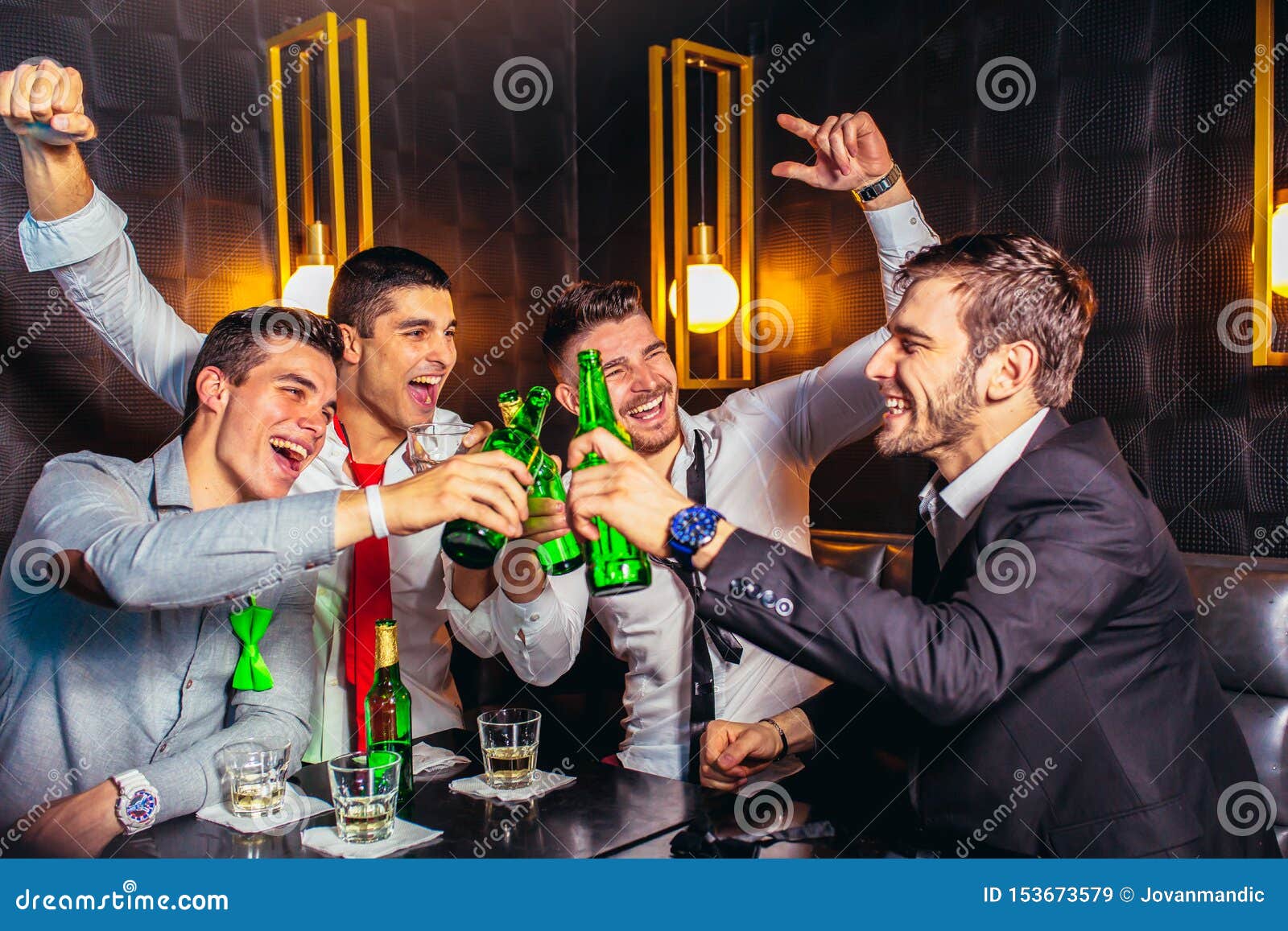 Young Men Toasting at a Nightclub Stock Image - Image of horizontal ...