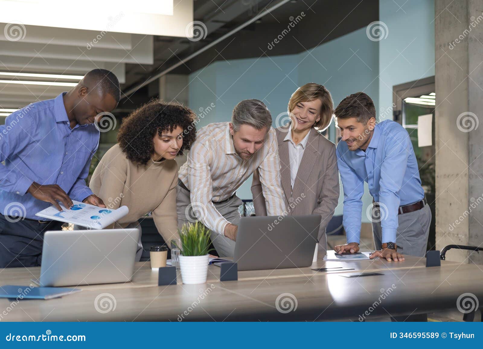 Group of Young Modern People Using Modern Technologies while Working in ...