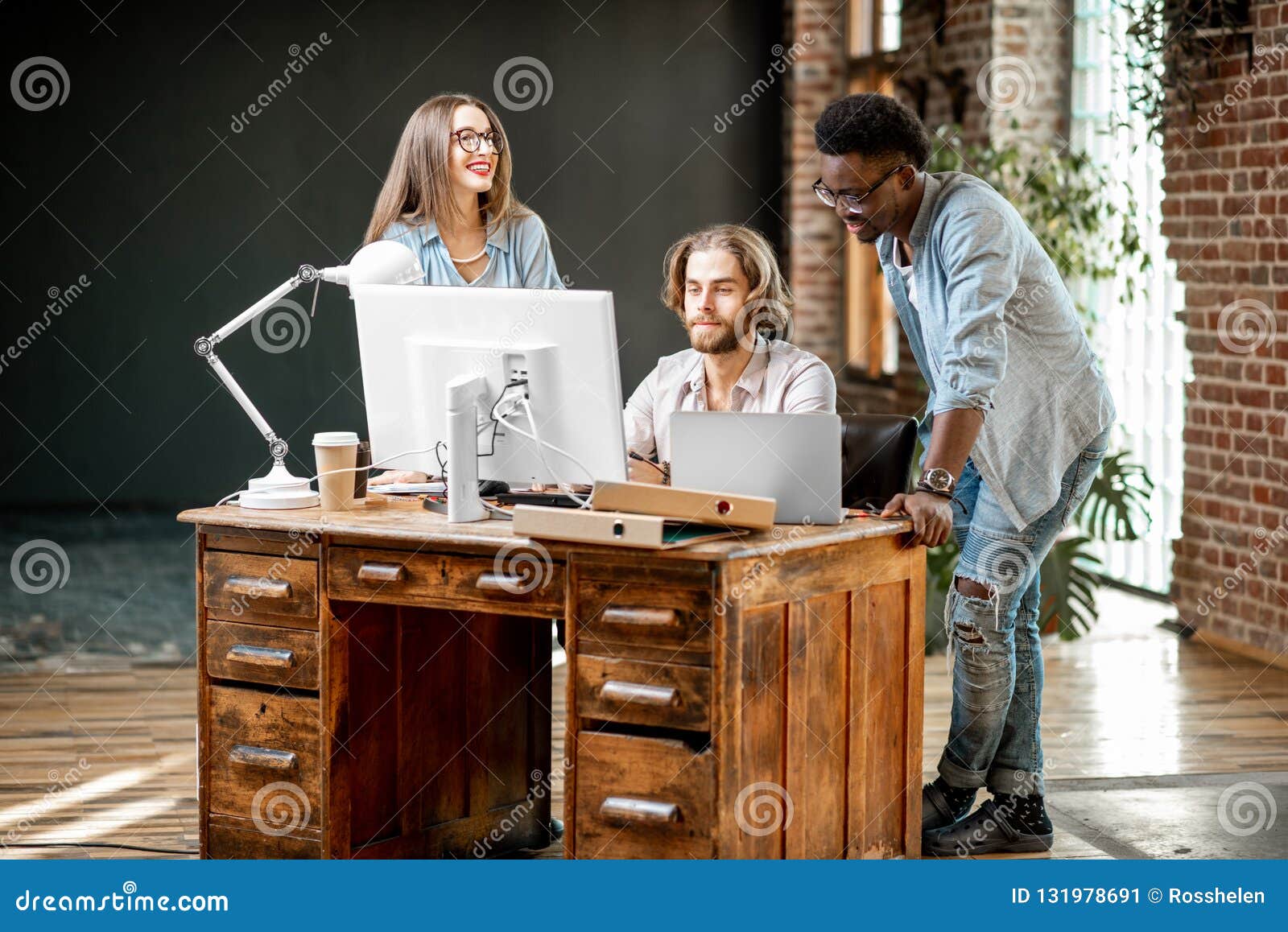 Young Coworkers Working with Computer Indoors Stock Image - Image of ...