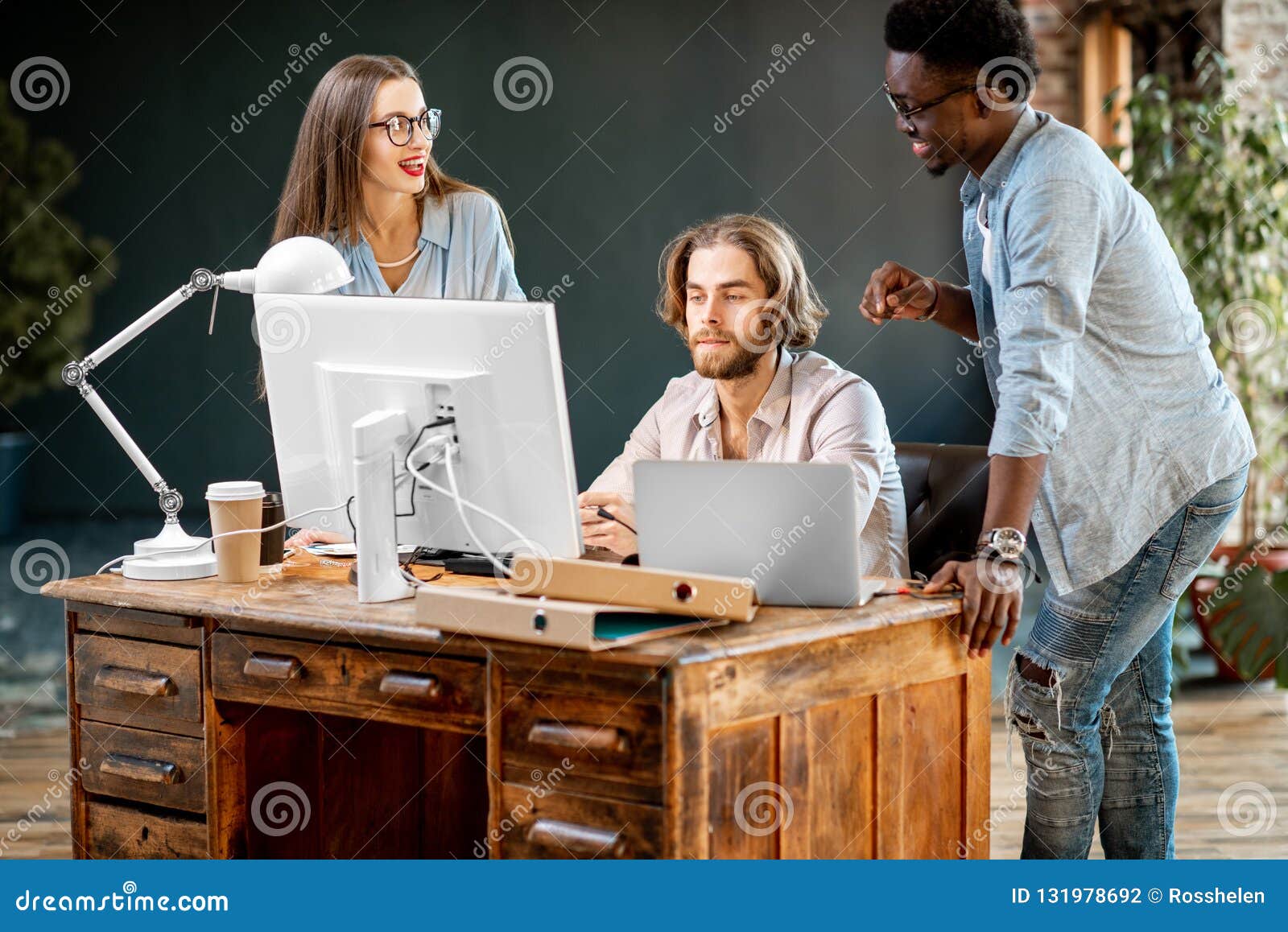 Young Coworkers Working with Computer Indoors Stock Photo - Image of ...