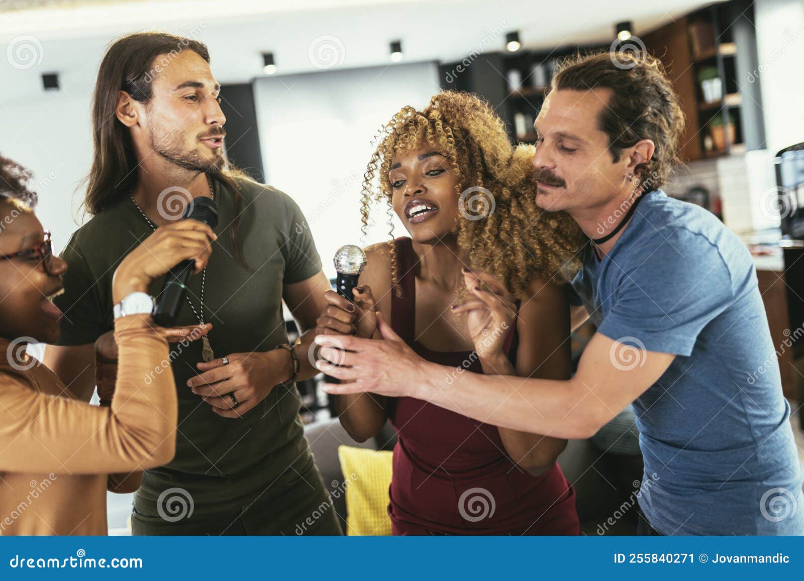 Young Multicultural Friends Having Party Singing Song Using Microphone ...