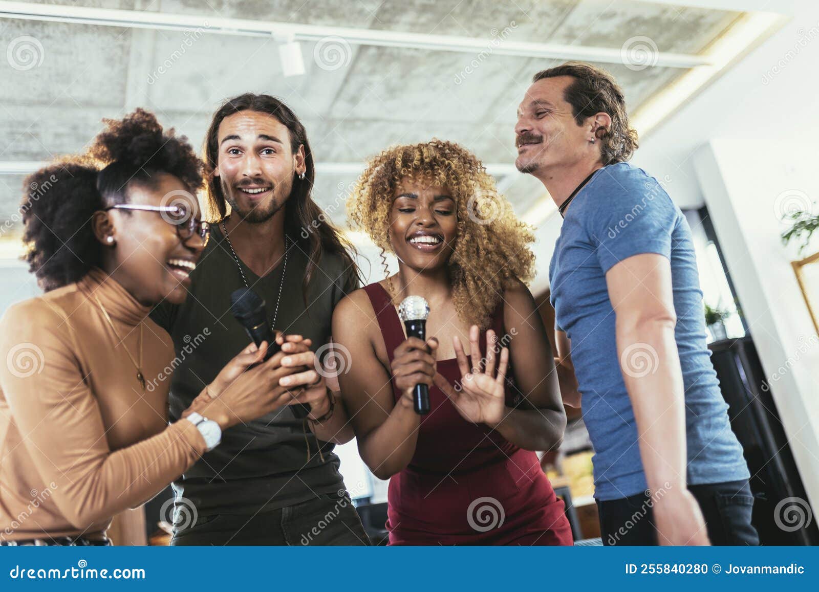Young Multicultural Friends Having Party Singing Song Using Microphone ...