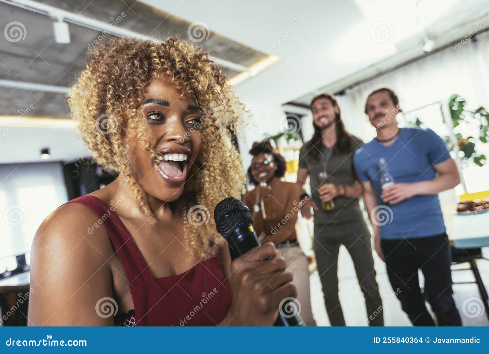 Young Multicultural Friends Having Party Singing Song Using Microphone ...