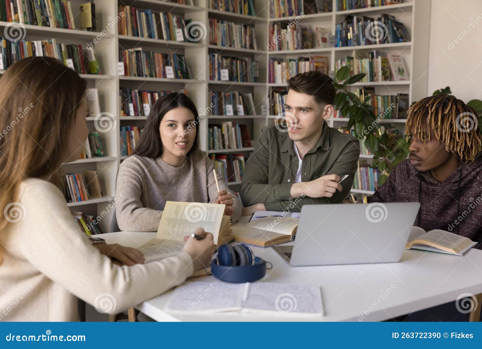 Group of Young Multiethnic College Students Talking in Library Stock ...