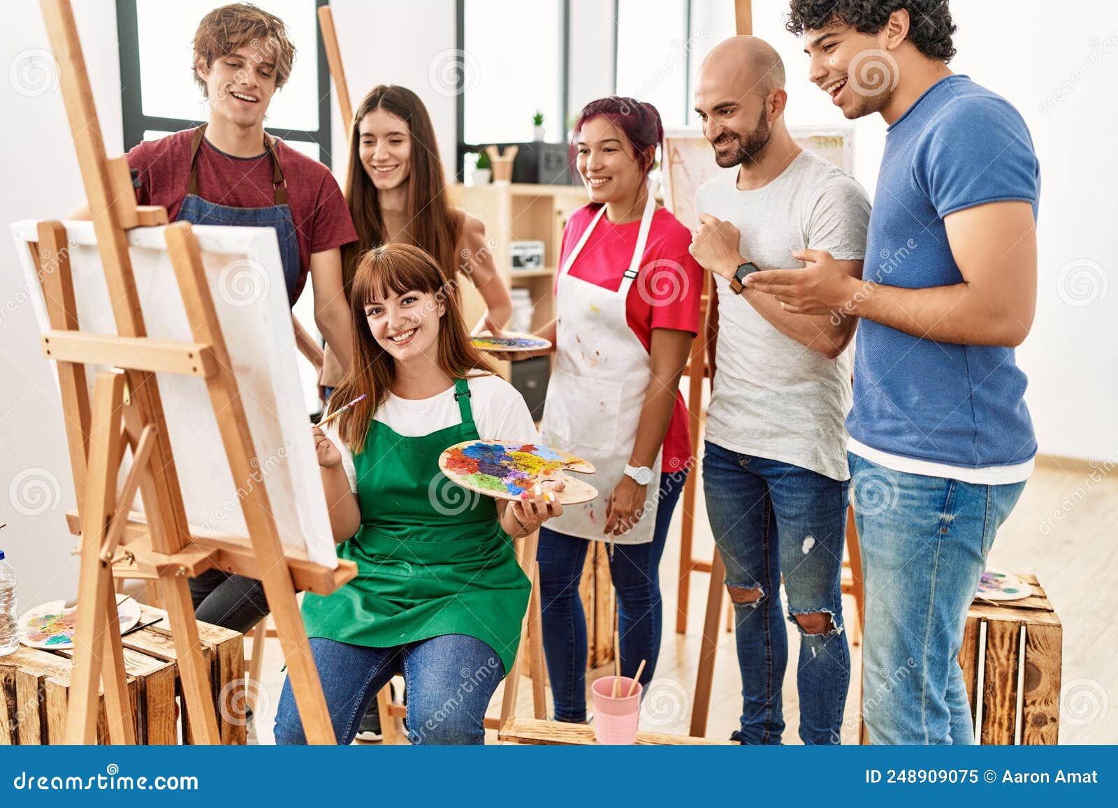Group of Young Paint Students Smiling Happy and Looking Draw of Partner ...