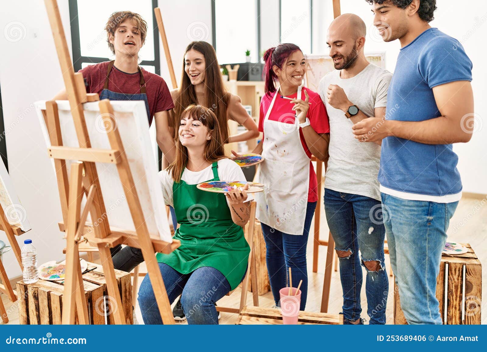 Group of Young Paint Students Smiling Happy and Looking Draw of Partner ...