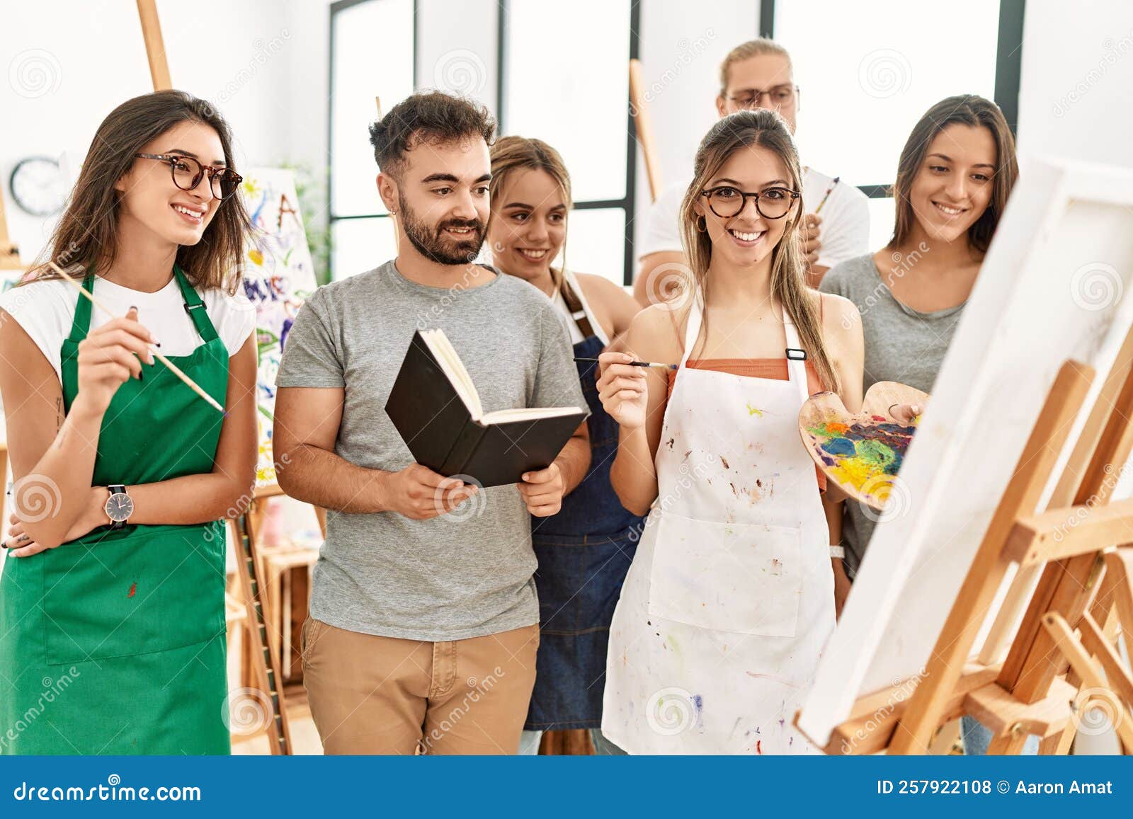 Group of Young Paint Students Smiling Happy and Looking Draw of Partner ...