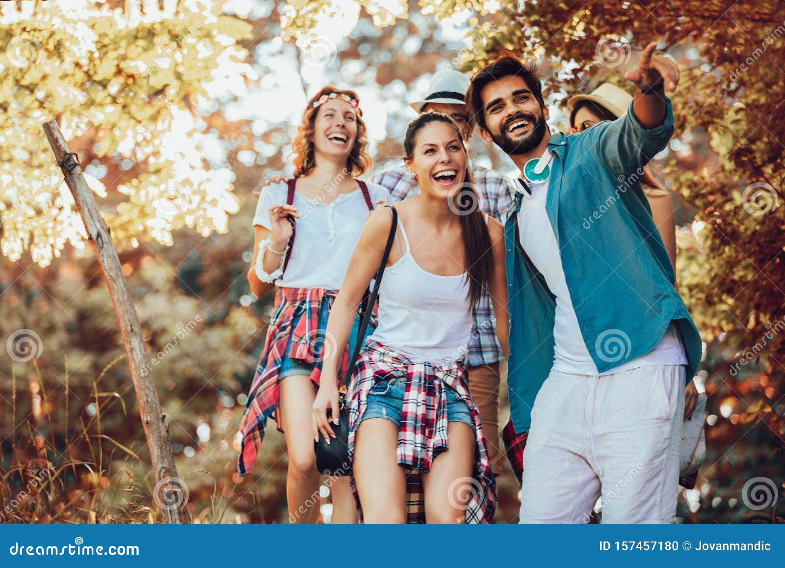 Young People with Backpacks Walking Together and Looking Happy Stock ...