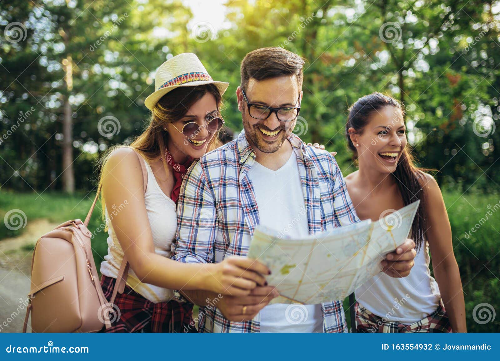 Young People with Backpacks Walking Together and Looking Happy Stock ...