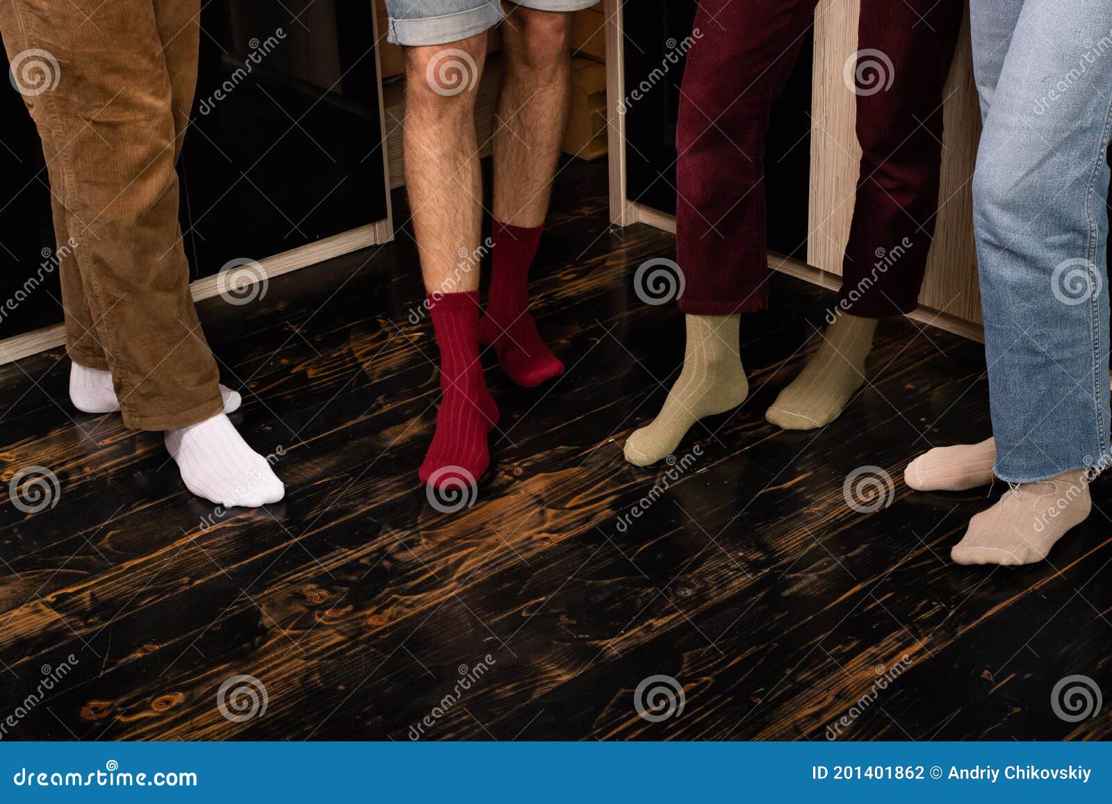 Group of Young People in Colored Socks in the Kitchen Talking. Close-up ...