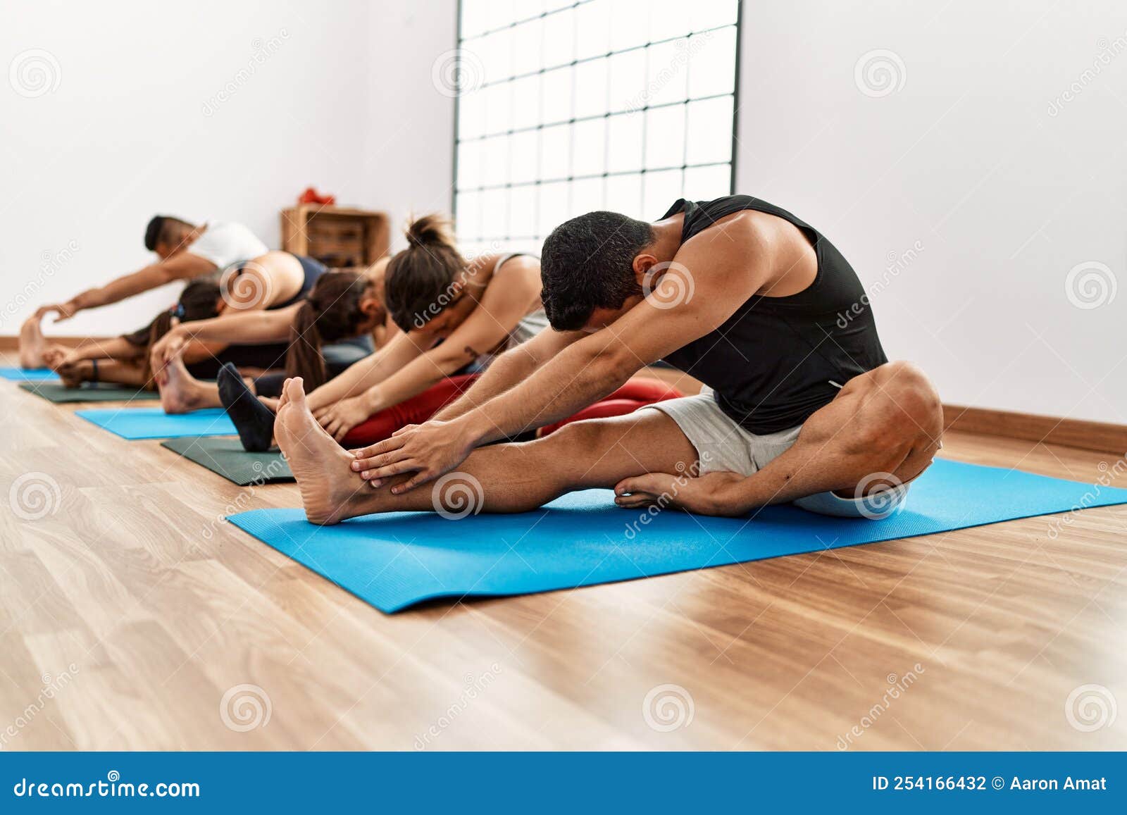 Group of Young People Concentrate Stretching at Sport Center Stock ...