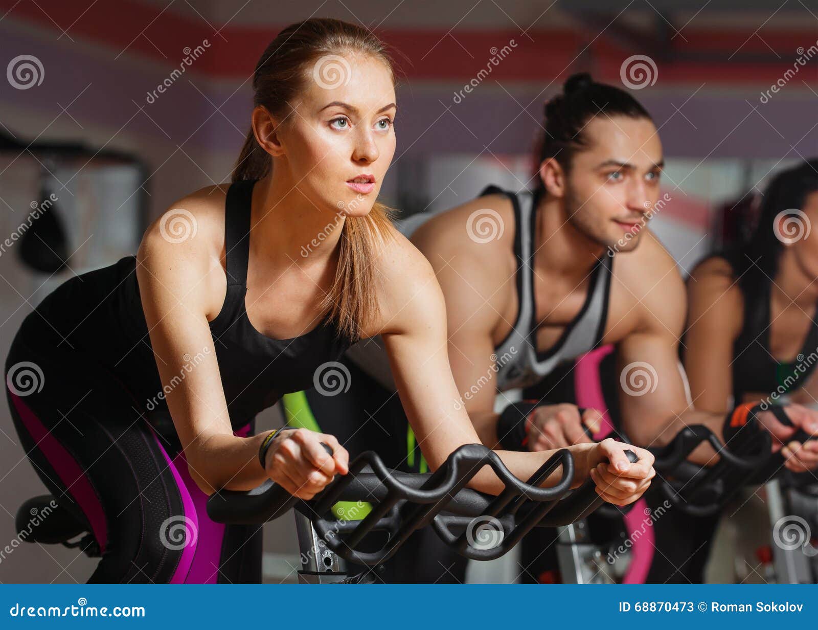 Group of Young People Cycling in Class in Gym Stock Image - Image of ...