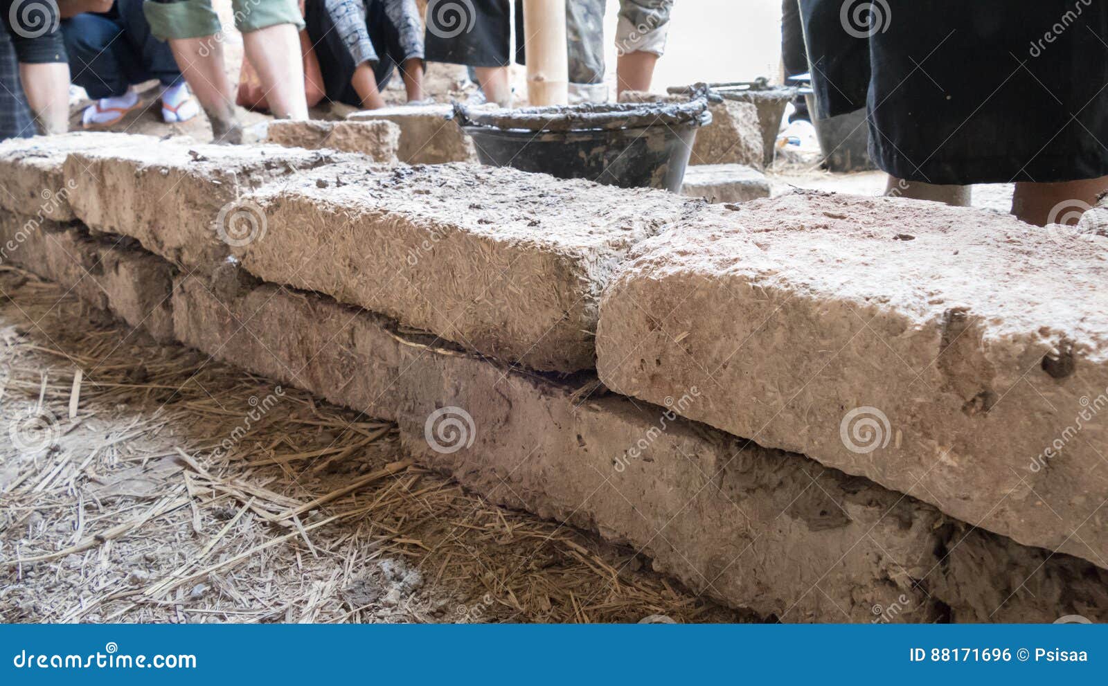 Group of Young People Earth Building the Wall of Earthen House Stock ...