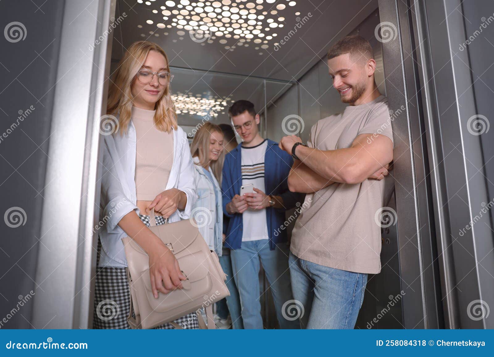 Group of Young People in Modern Elevator Stock Photo - Image of ...