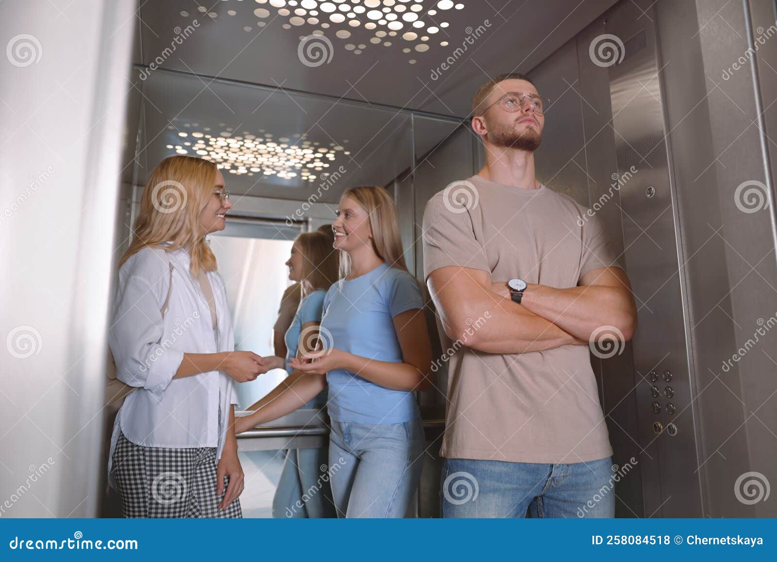 Group of Young People in Modern Elevator Stock Photo - Image of indoors, inside: 258084518