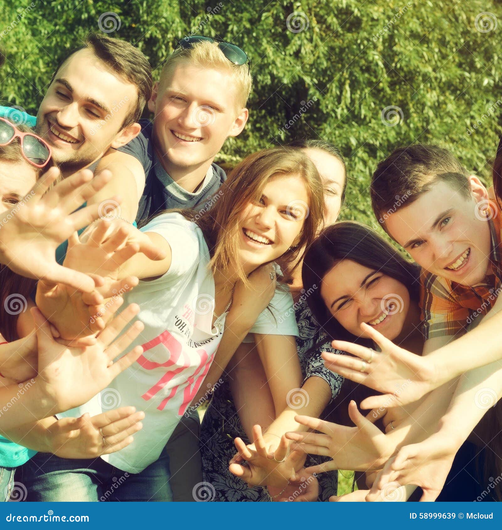 Group of Young People with Hands Together Smiling and Having Fun Stock ...