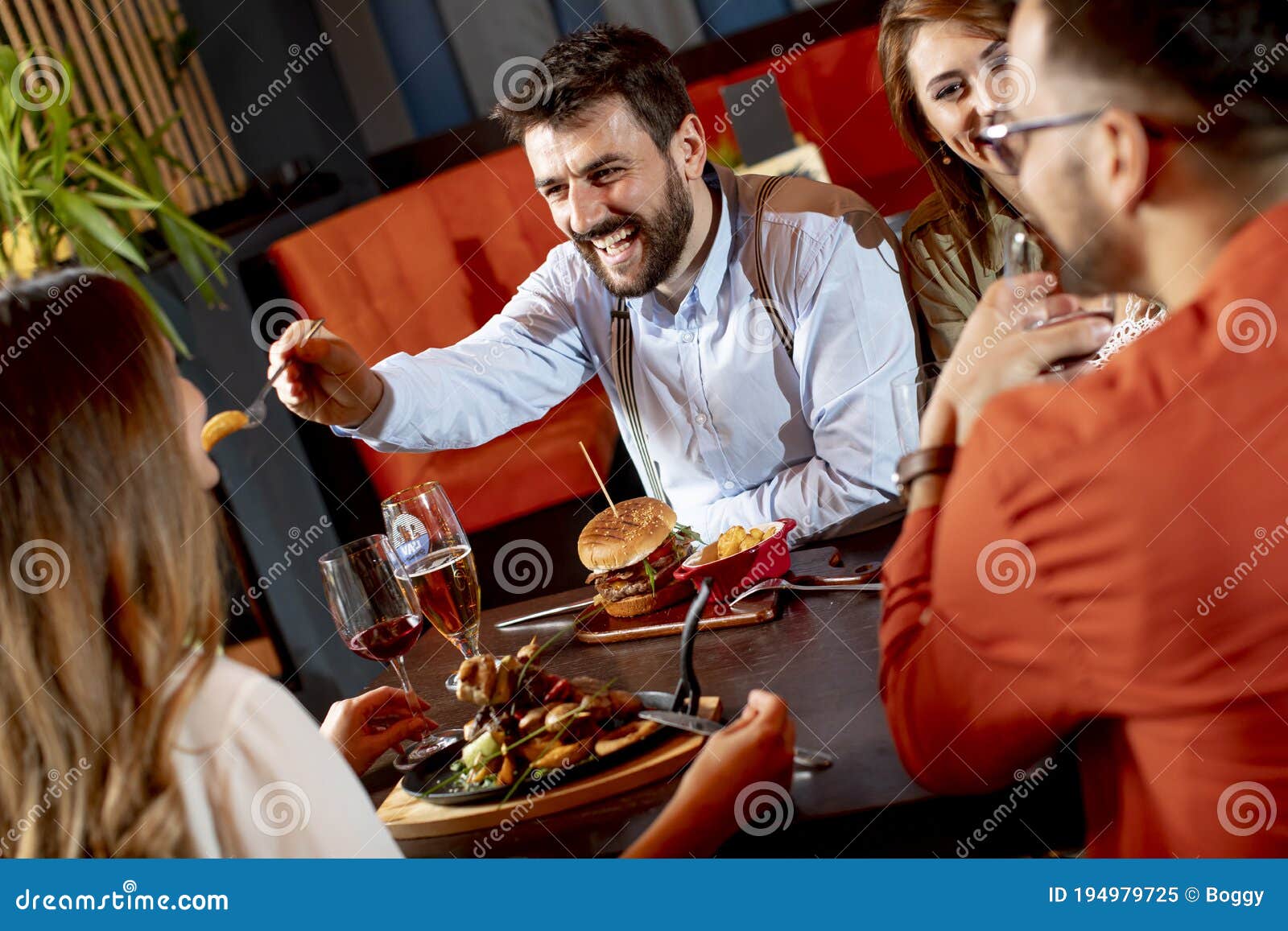 Young People Having Dinner in the Restaurant Stock Image - Image of ...
